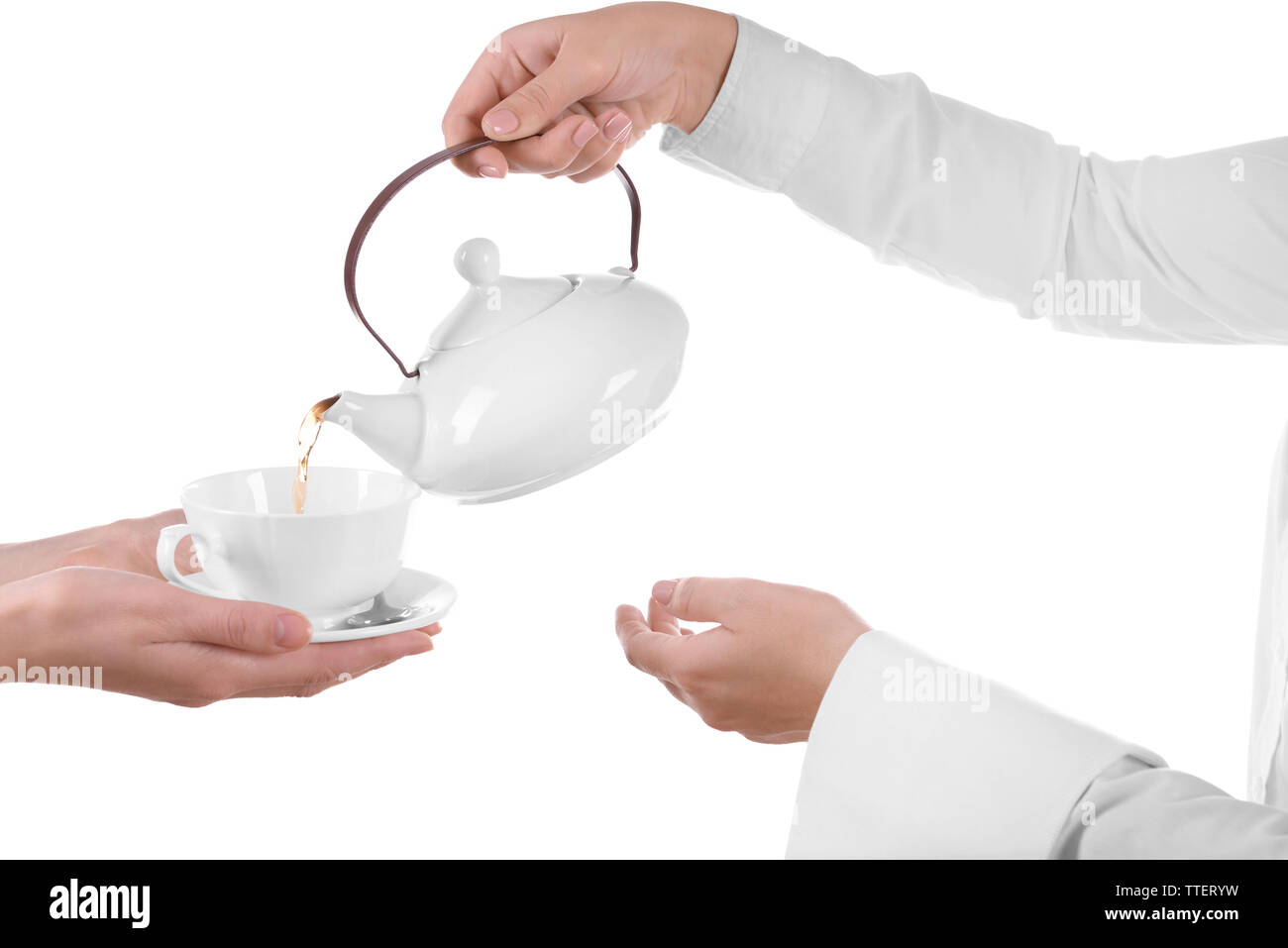 Waiter pouring tea to customer in cup isolated on white Stock Photo - Alamy