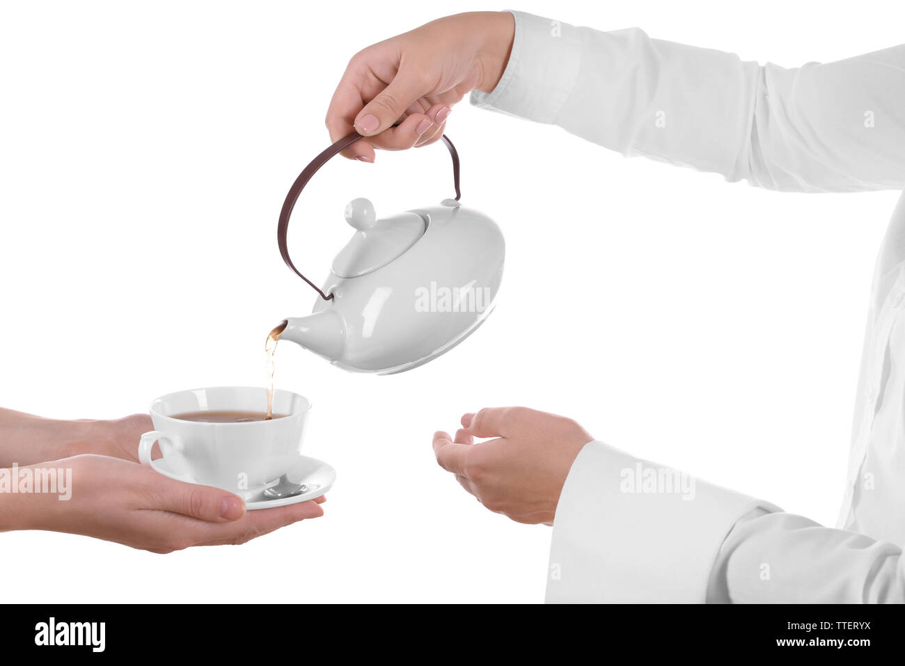 Waiter pouring tea to customer in cup isolated on white Stock Photo - Alamy