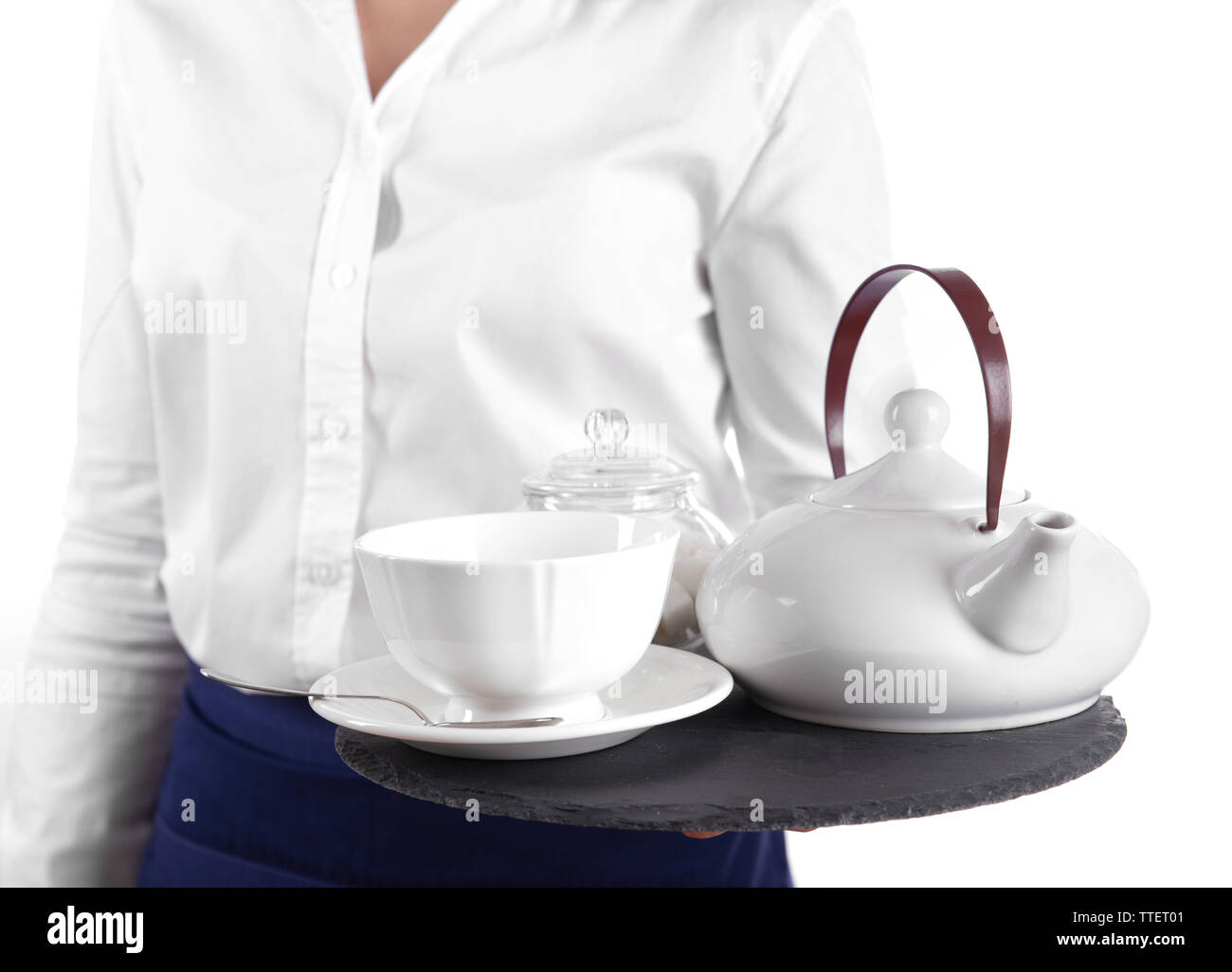 Waiter holding tray with cup and teapot on white background Stock Photo ...