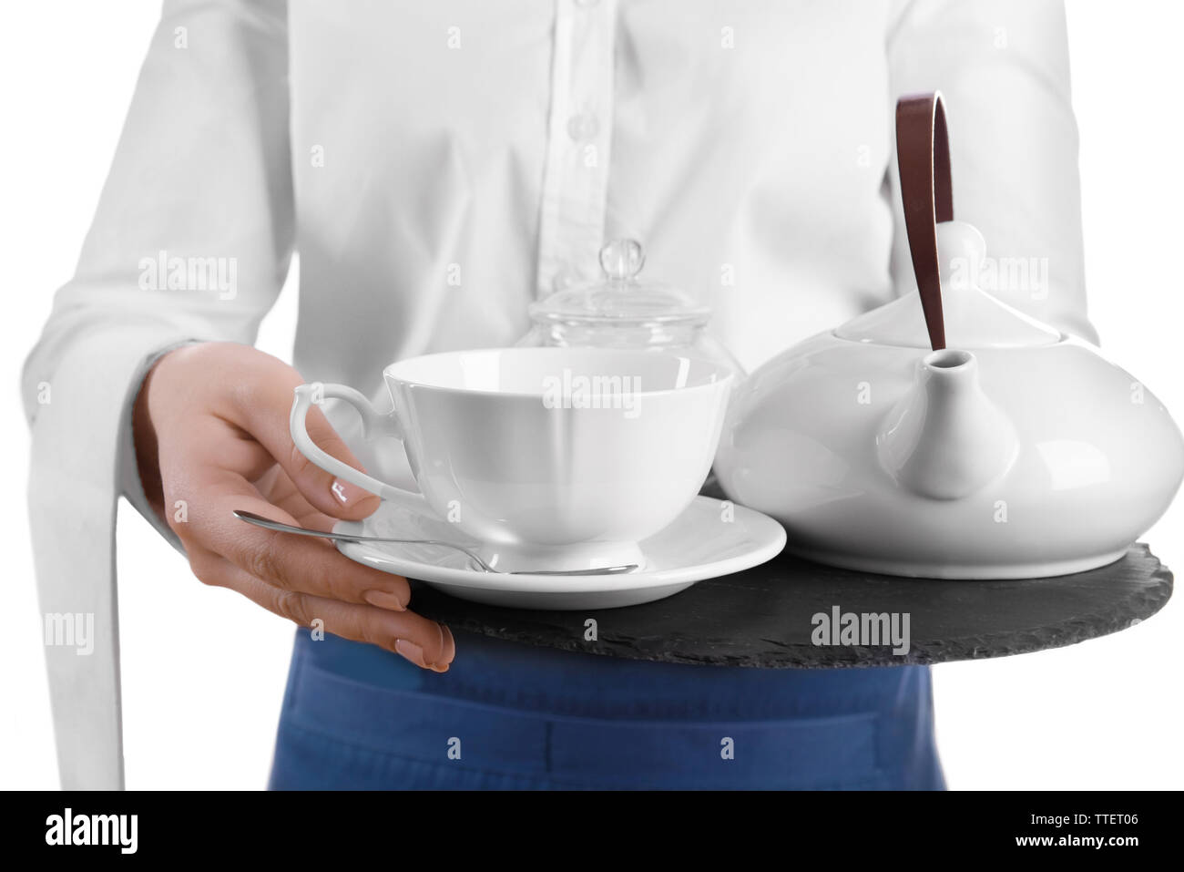 Waiter holding tray with cup and teapot on white background Stock Photo ...
