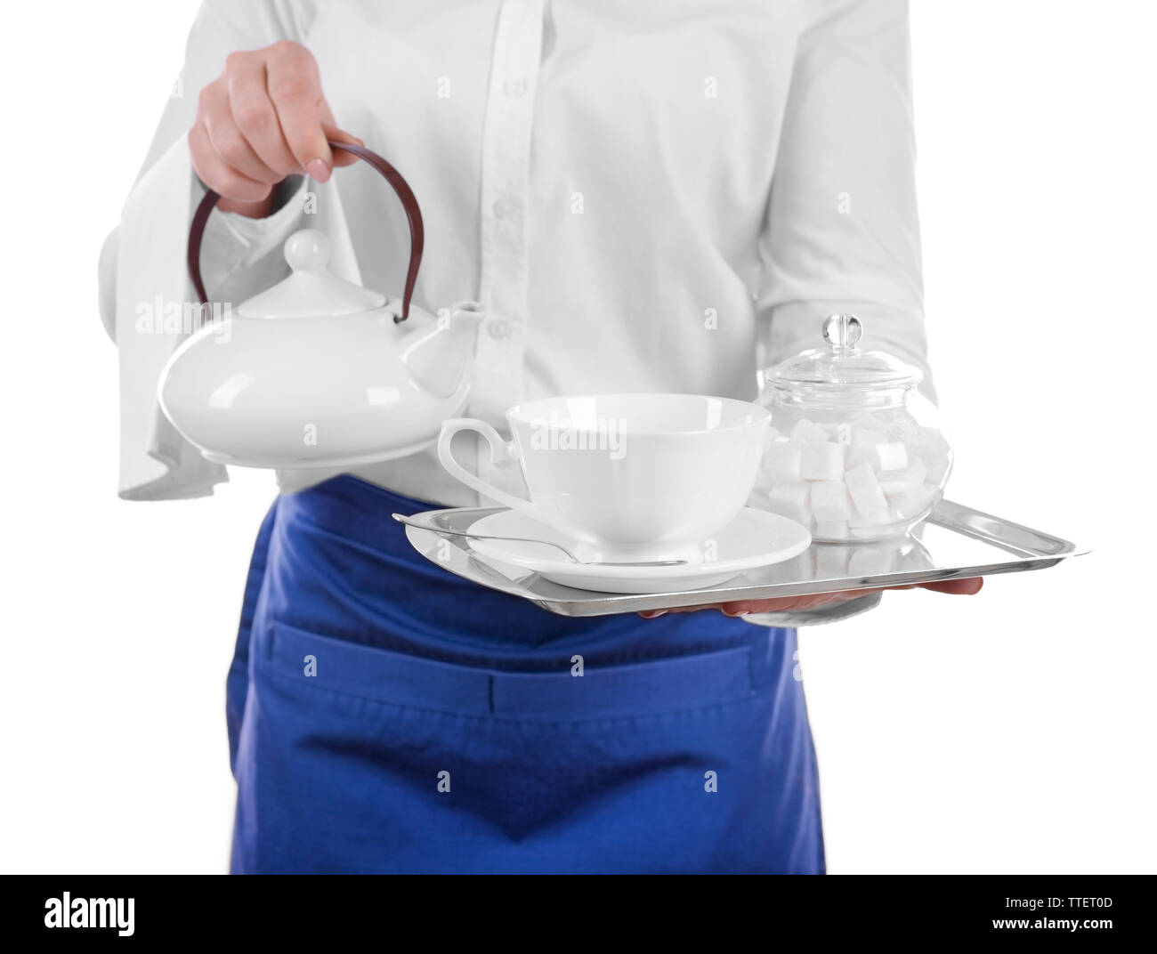 Waiter holding tray with teapot and cup on white background Stock Photo ...