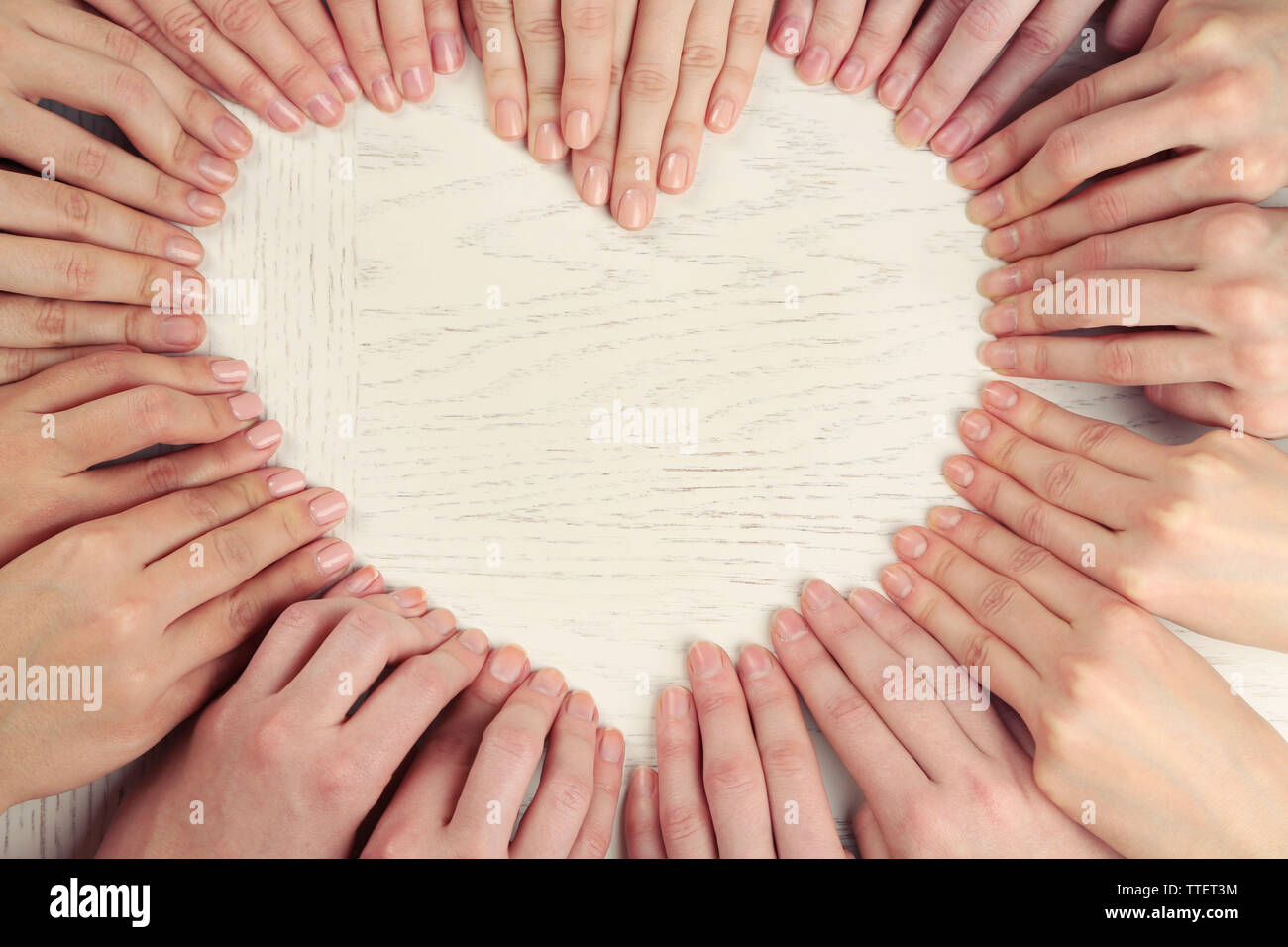 Group of people making heart symbol hi-res stock photography and images ...