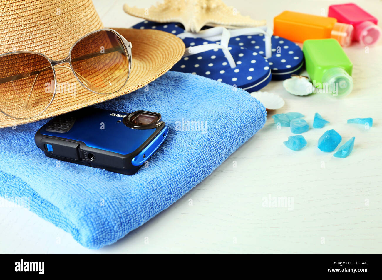 Summer accessories on wooden table, close up Stock Photo - Alamy