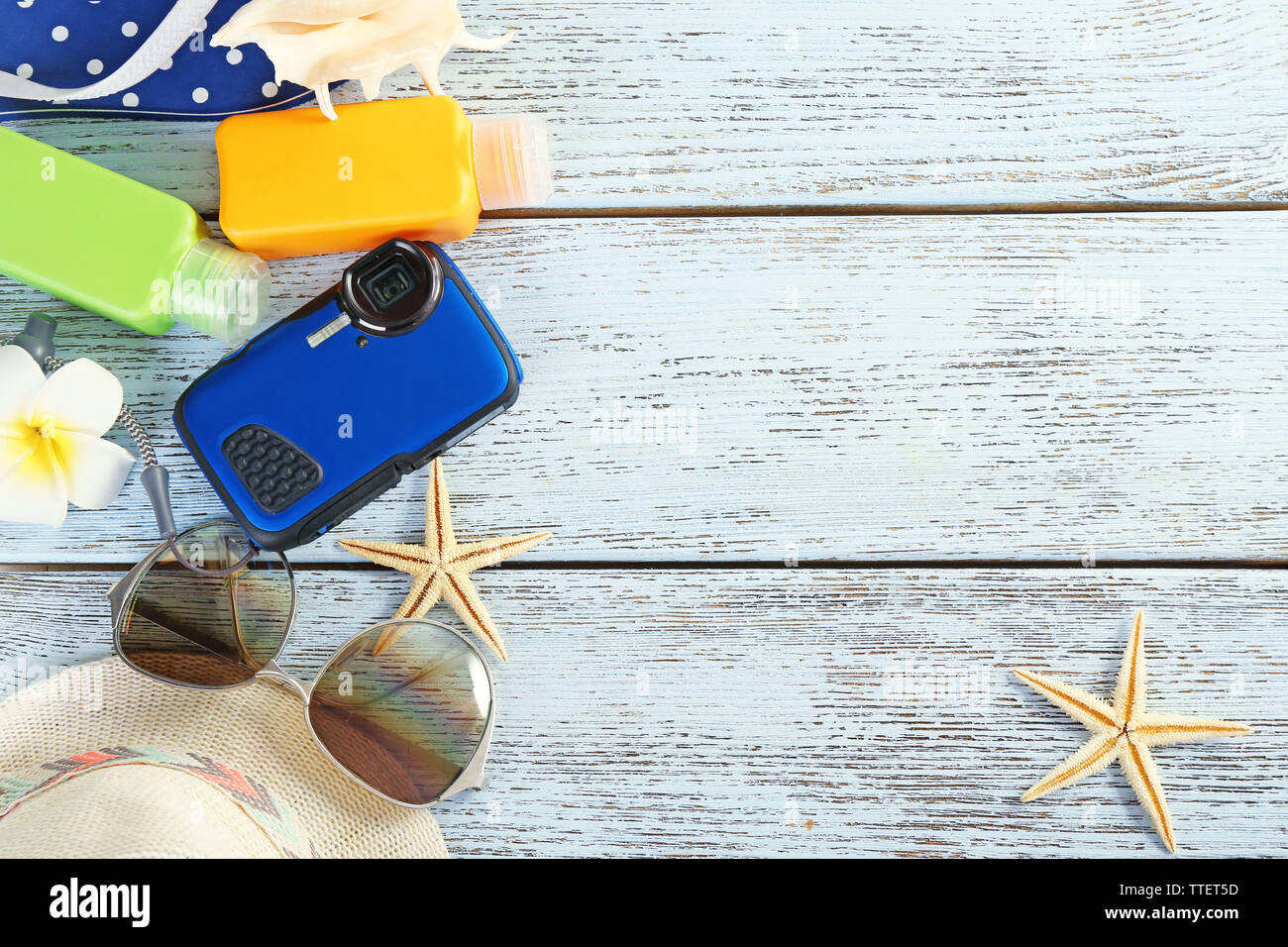 Summer accessories on wooden table, close up Stock Photo - Alamy