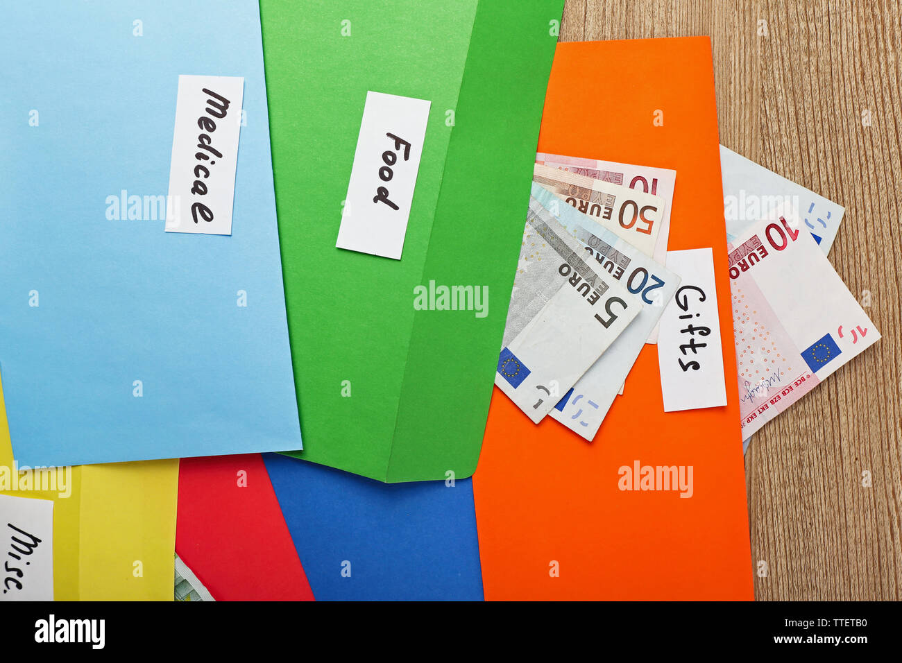 Distribution of money, financial planning, euro and bright envelopes ...