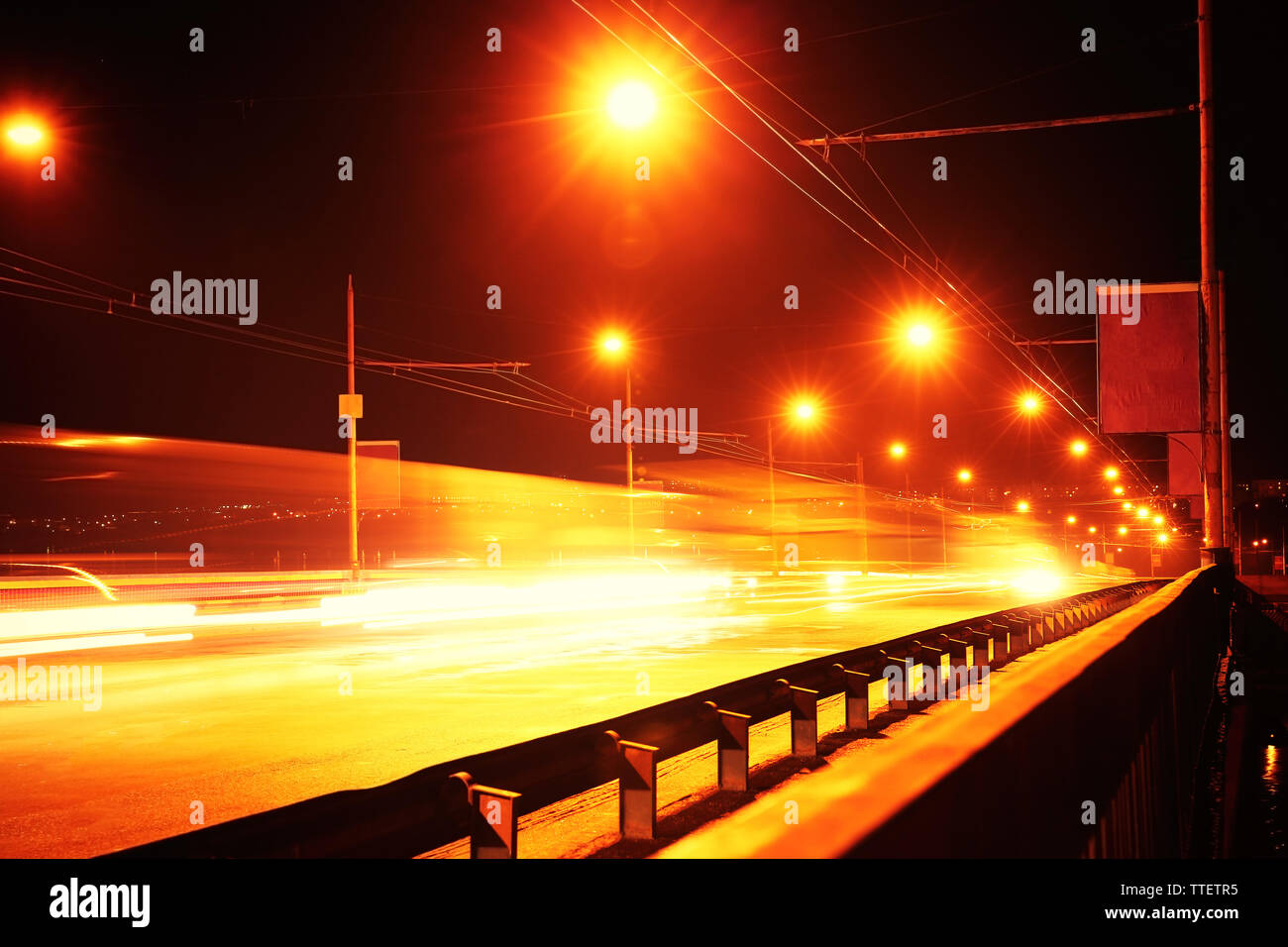 Freeway through the bridge at night Stock Photo - Alamy