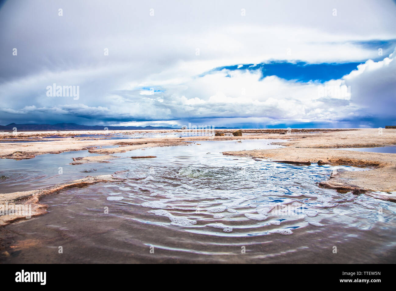 Water spring at Salt lake, Salar de Uyuni in Bolivia, south America ...