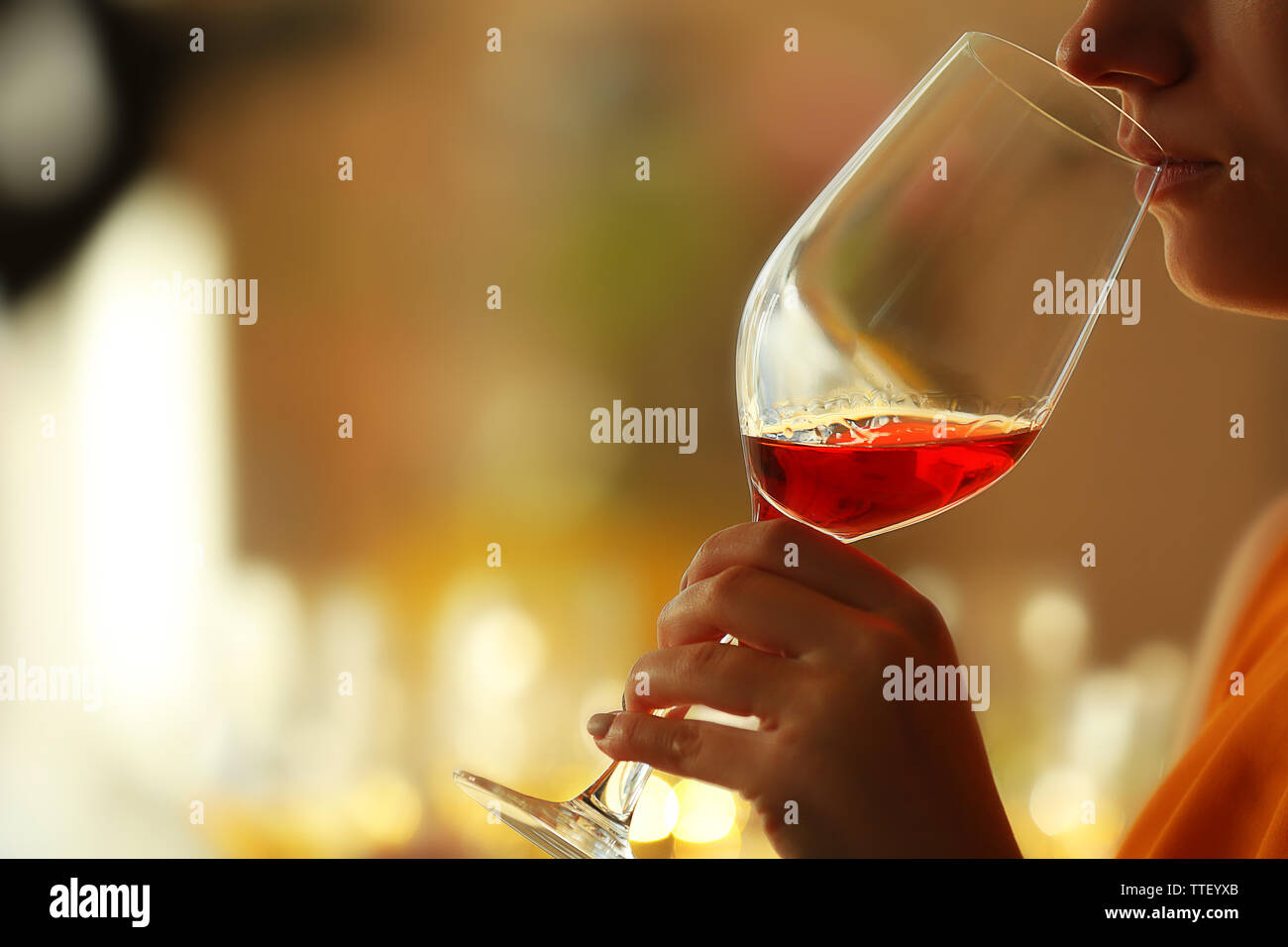 Woman sniffing red wine in a glass, close up Stock Photo - Alamy