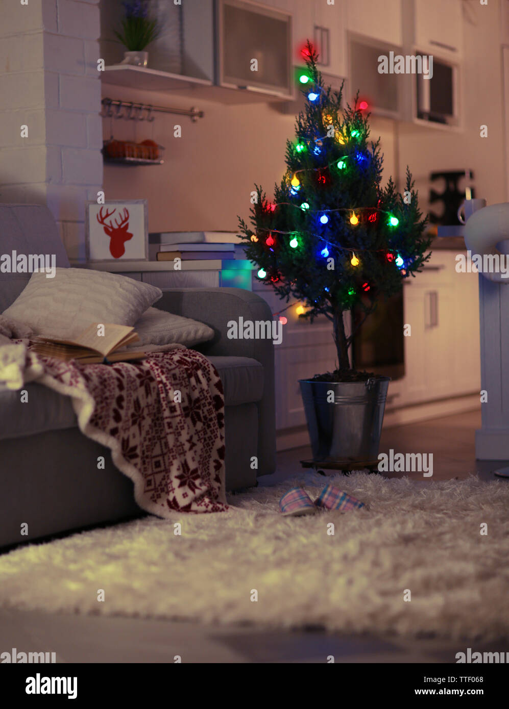 Living room interior with grey sofa and lighted Christmas tree Stock ...