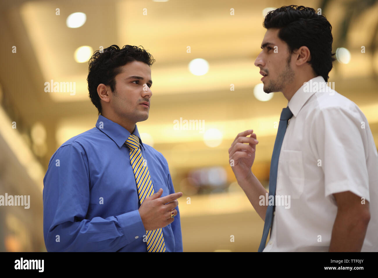 Two Indian business executives discussing in an office Stock Photo - Alamy