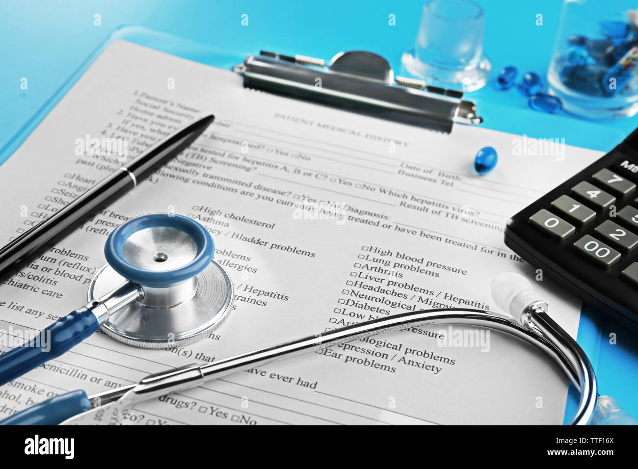 Medical Stethoscope Clipboard Pen And Calculator Close Up Stock