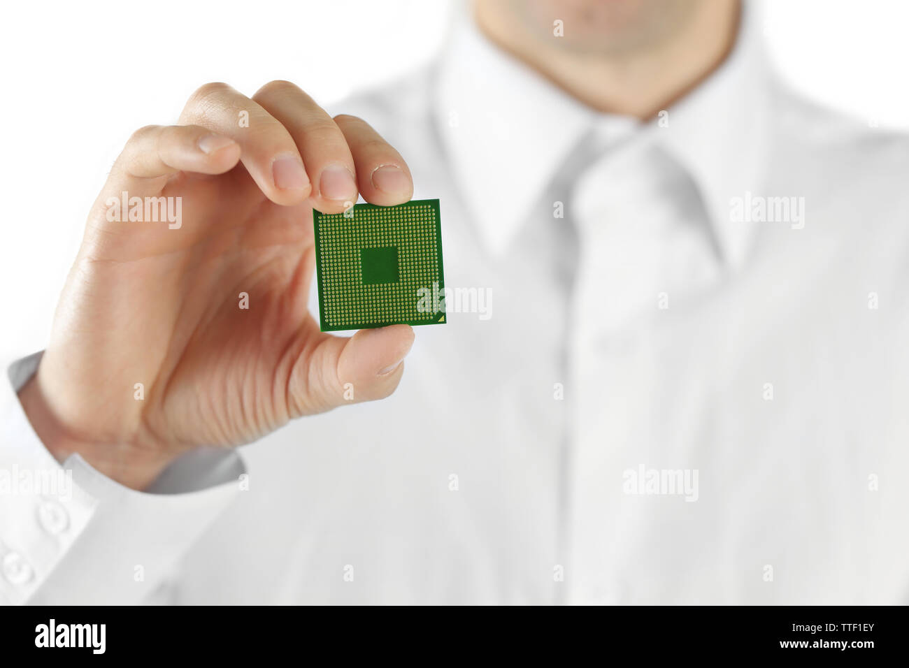 Man holding microprocessor in his hand on white background Stock Photo ...