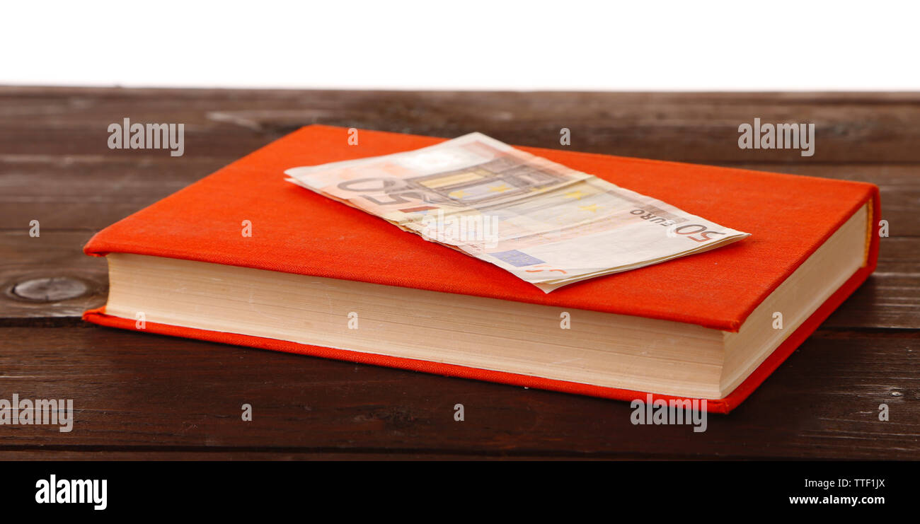Red book with euro banknotes on white background. Stash of money Stock ...
