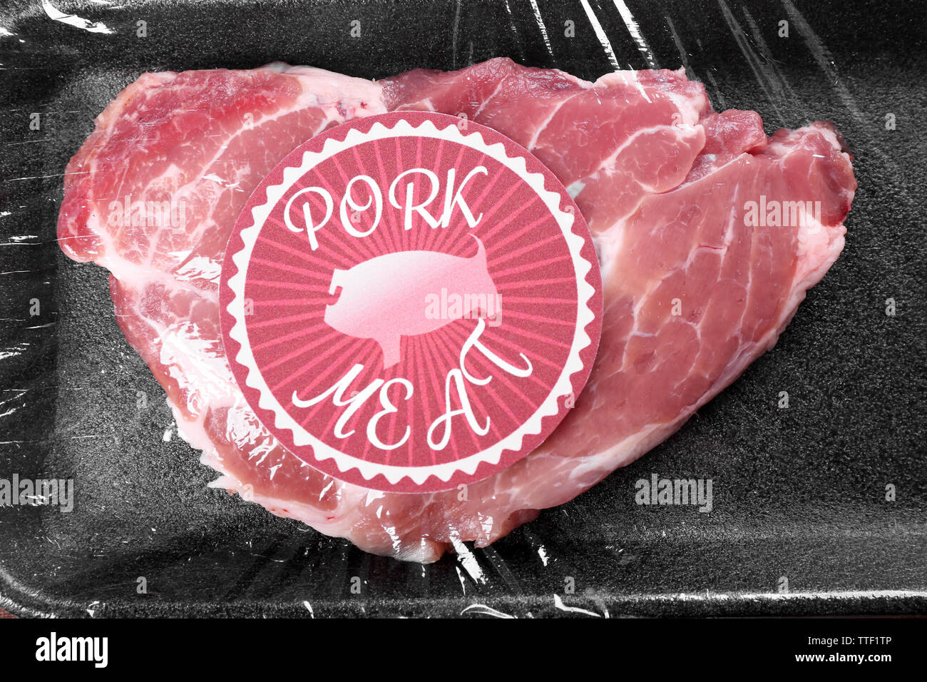 Packed piece of pork meat, close up Stock Photo - Alamy