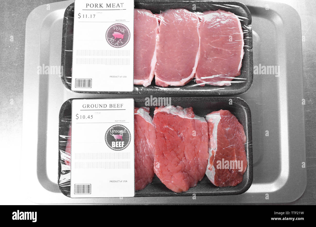 Packed pieces of pork and beef meat on metal background Stock Photo - Alamy