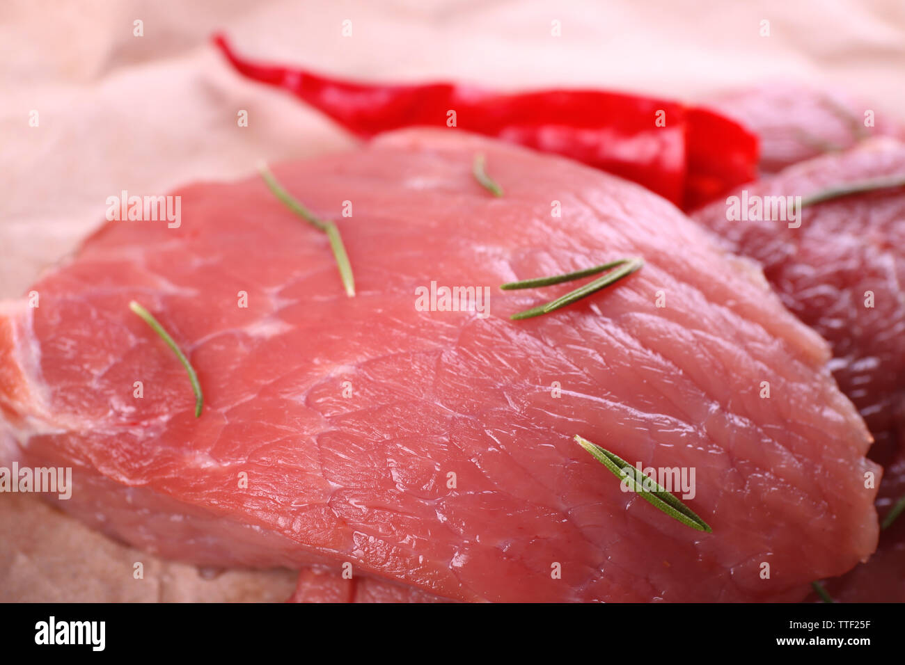 Row beefsteak with rosemary hi-res stock photography and images - Alamy