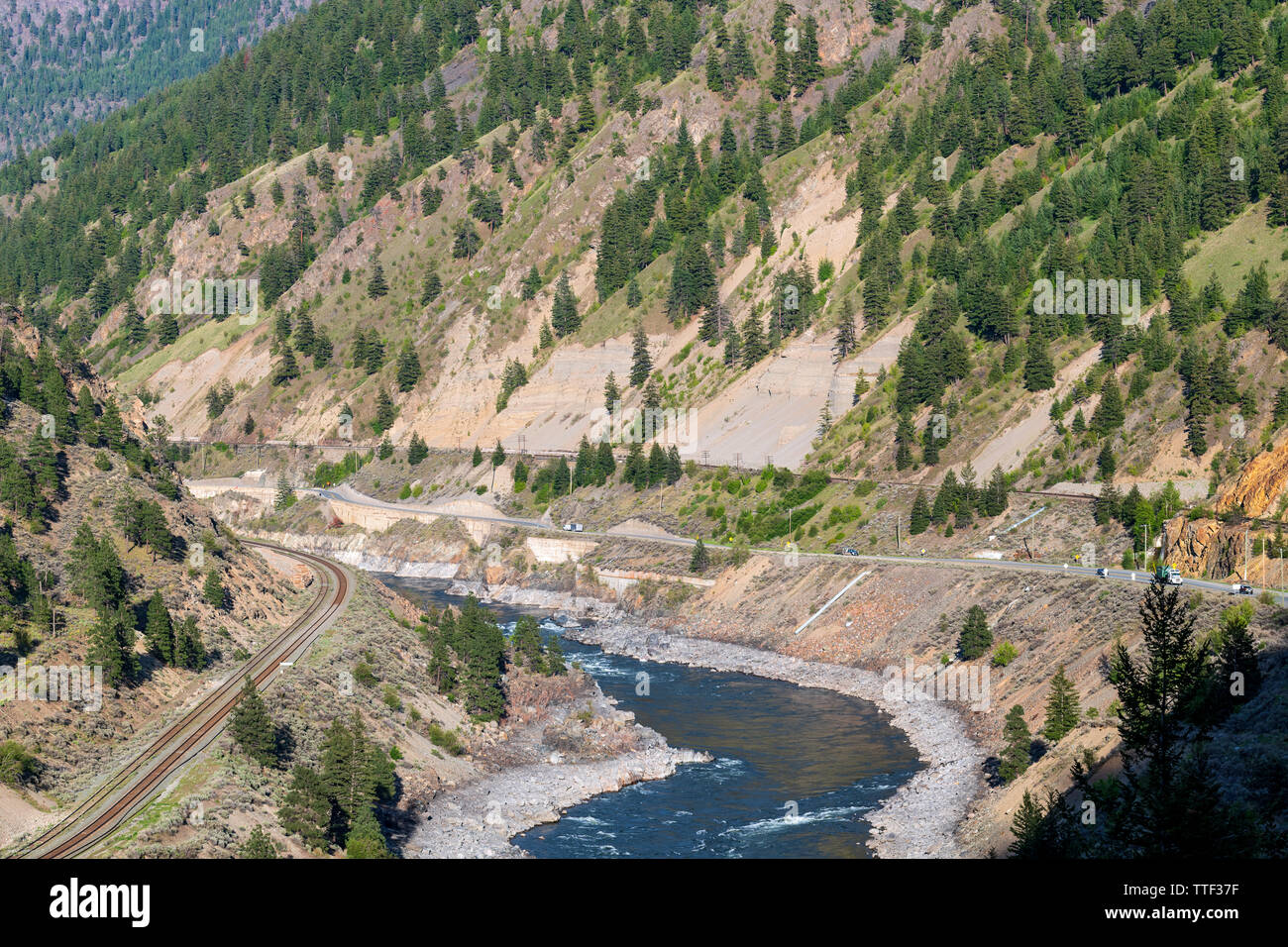 Railroad tracks and the Trans-Canada highway in the Thompson River ...