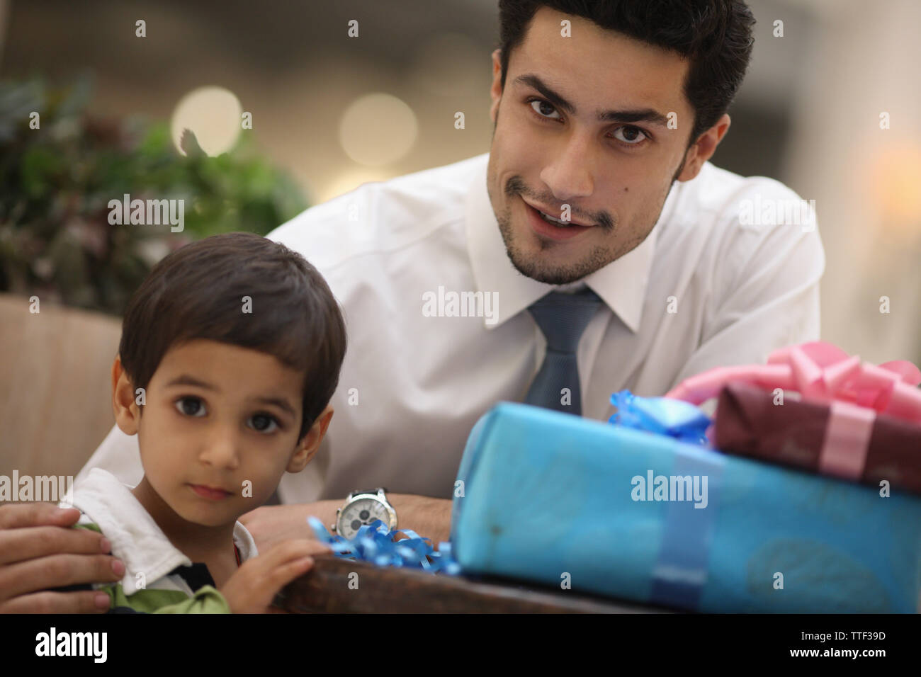 Portrait of an Indian man with his son Stock Photo - Alamy