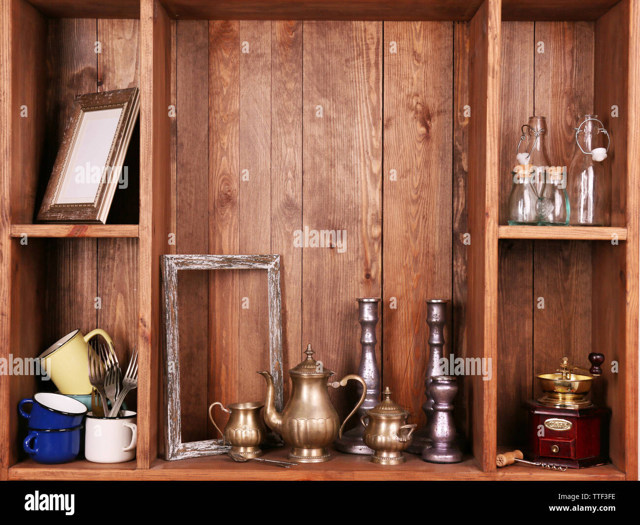 Wooden shelves with antiques things Stock Photo - Alamy