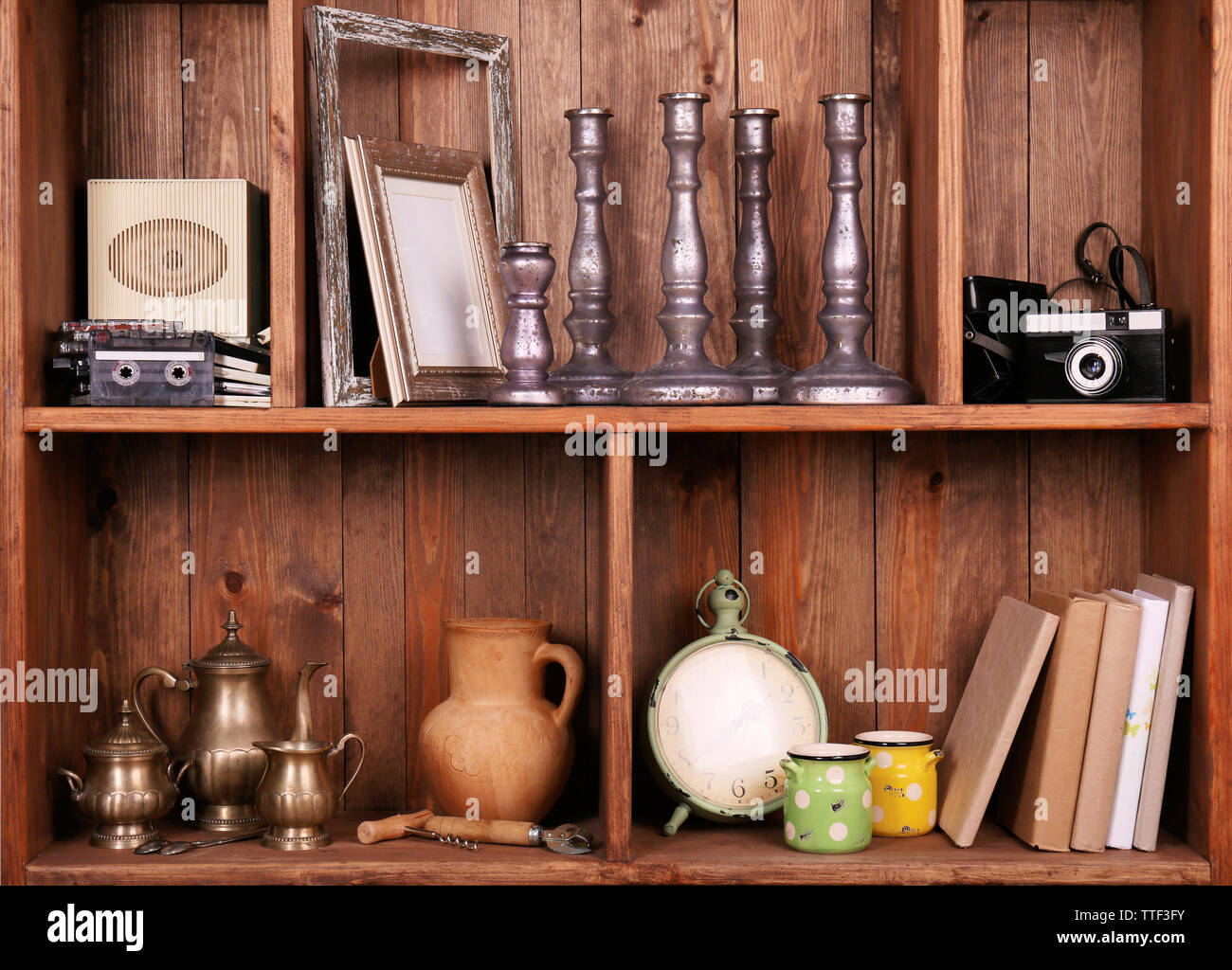 Wooden shelves with antiques things Stock Photo - Alamy