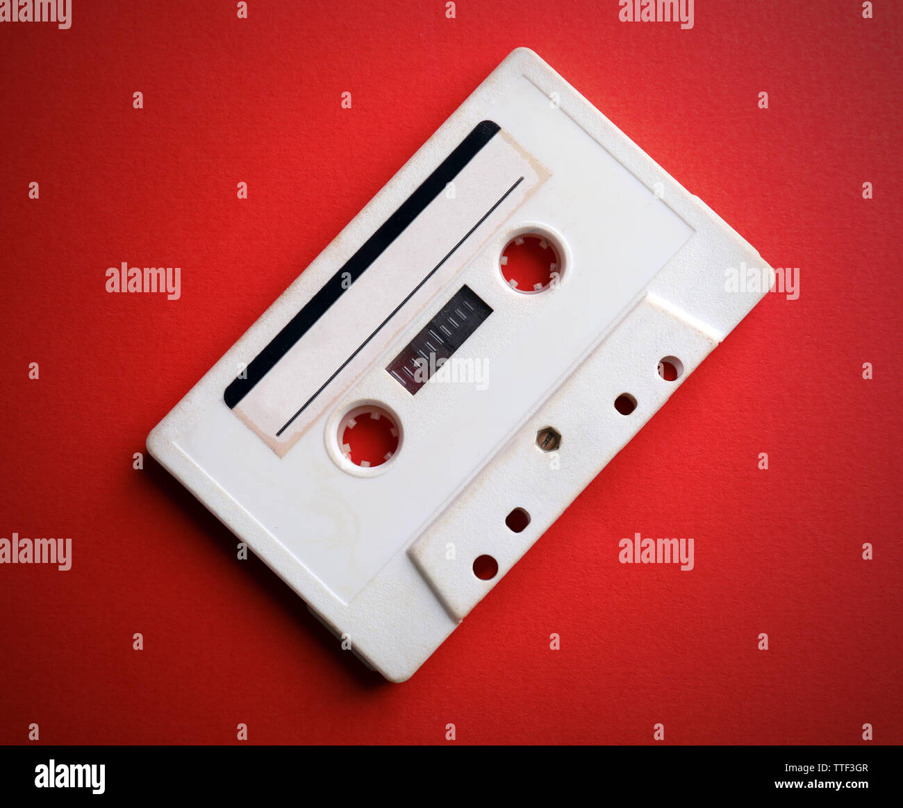Old audio cassette on red background Stock Photo - Alamy