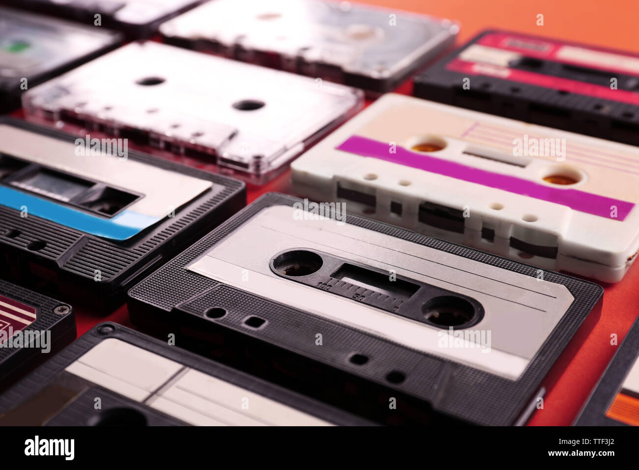 Set of old audio cassettes on red background Stock Photo - Alamy