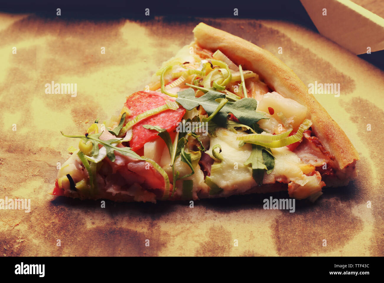 Piece of fresh pizza on cardboard background Stock Photo - Alamy