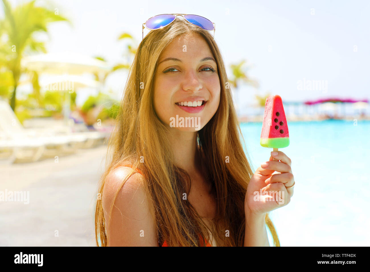Happy Beautiful Girl Eating Popsicle Ice Pop In Form Of Watermelon