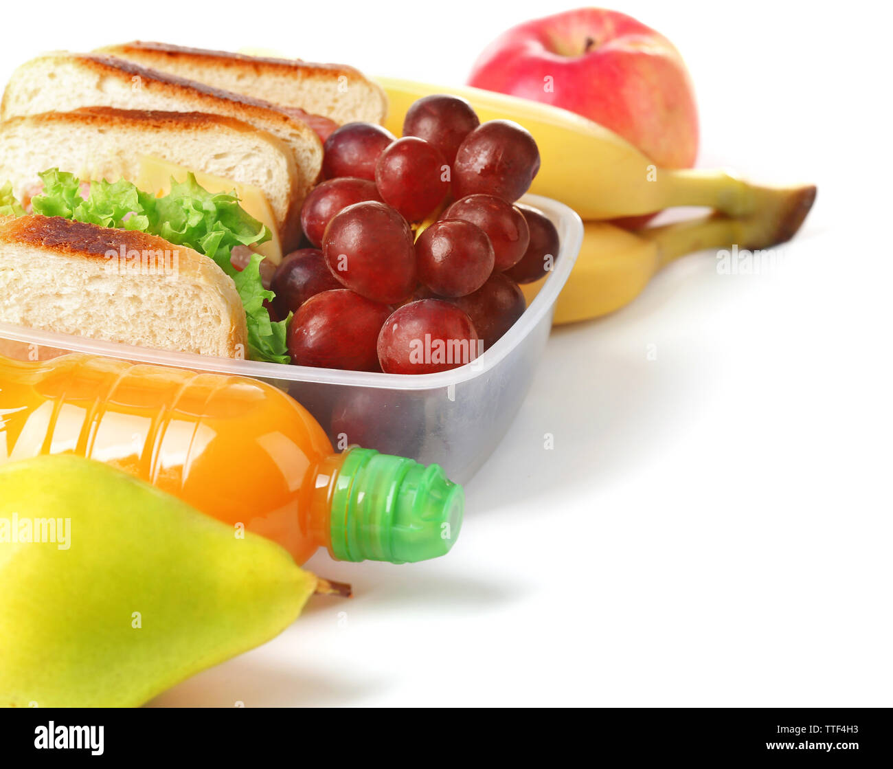 Healthy school lunch with sandwich, fruits and juice isolated on white ...