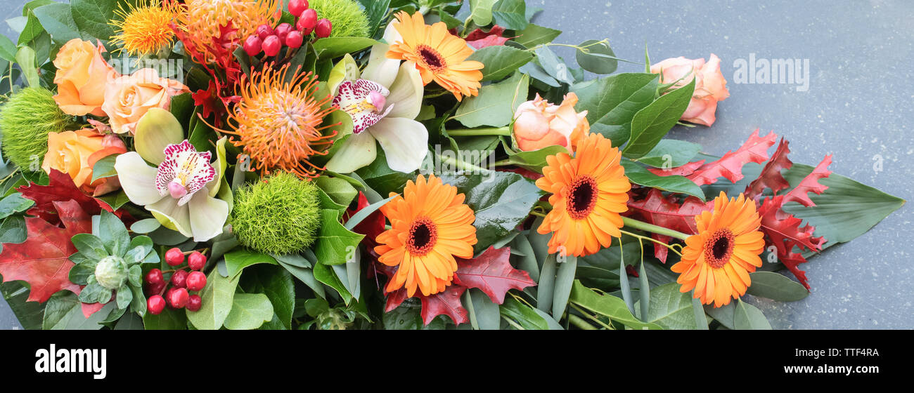 Flower arrangement. Overhead view and close up of orange flowers ...