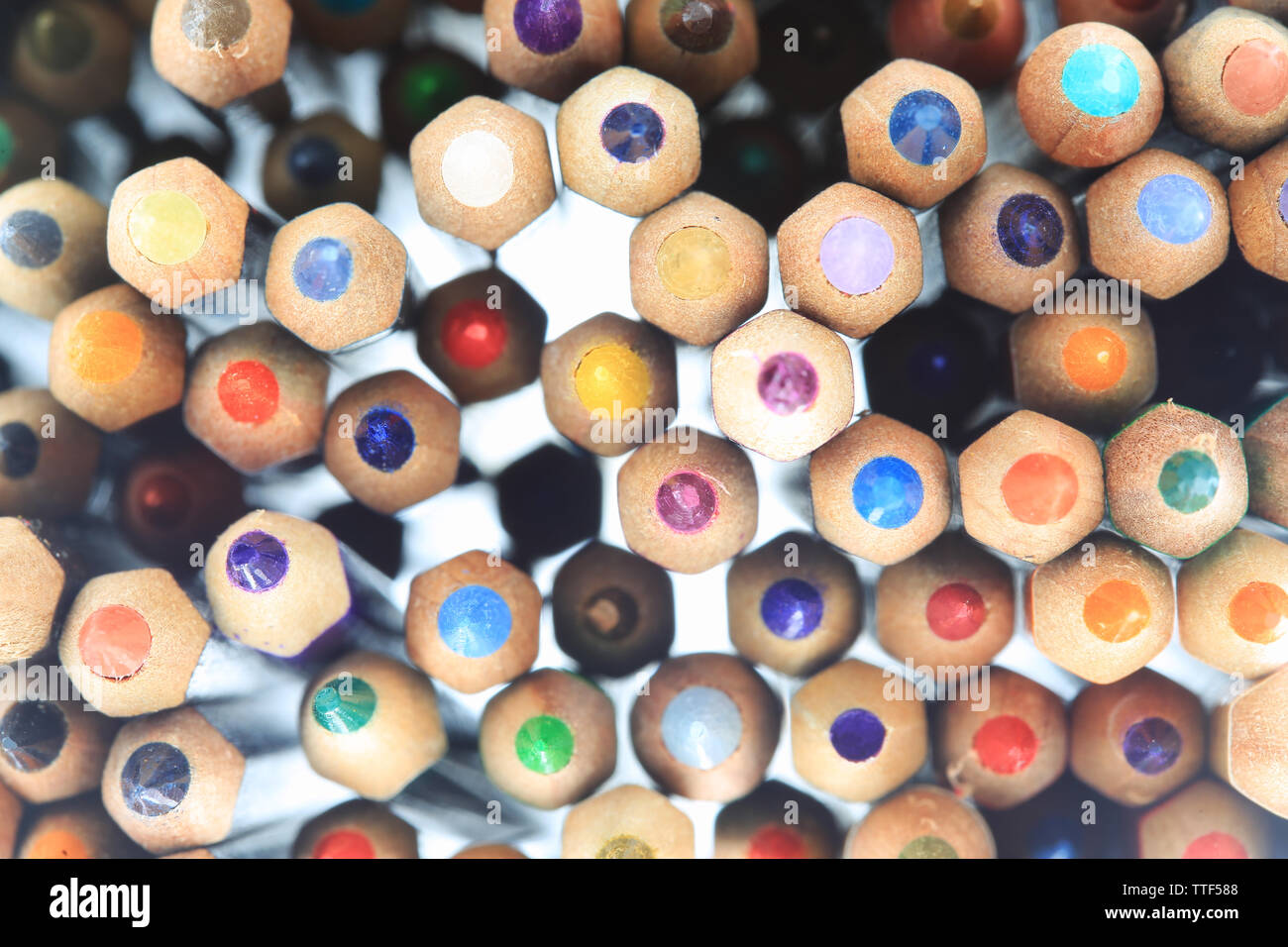 colored pencils stacked. random rainbow color pattern pencils close up ...