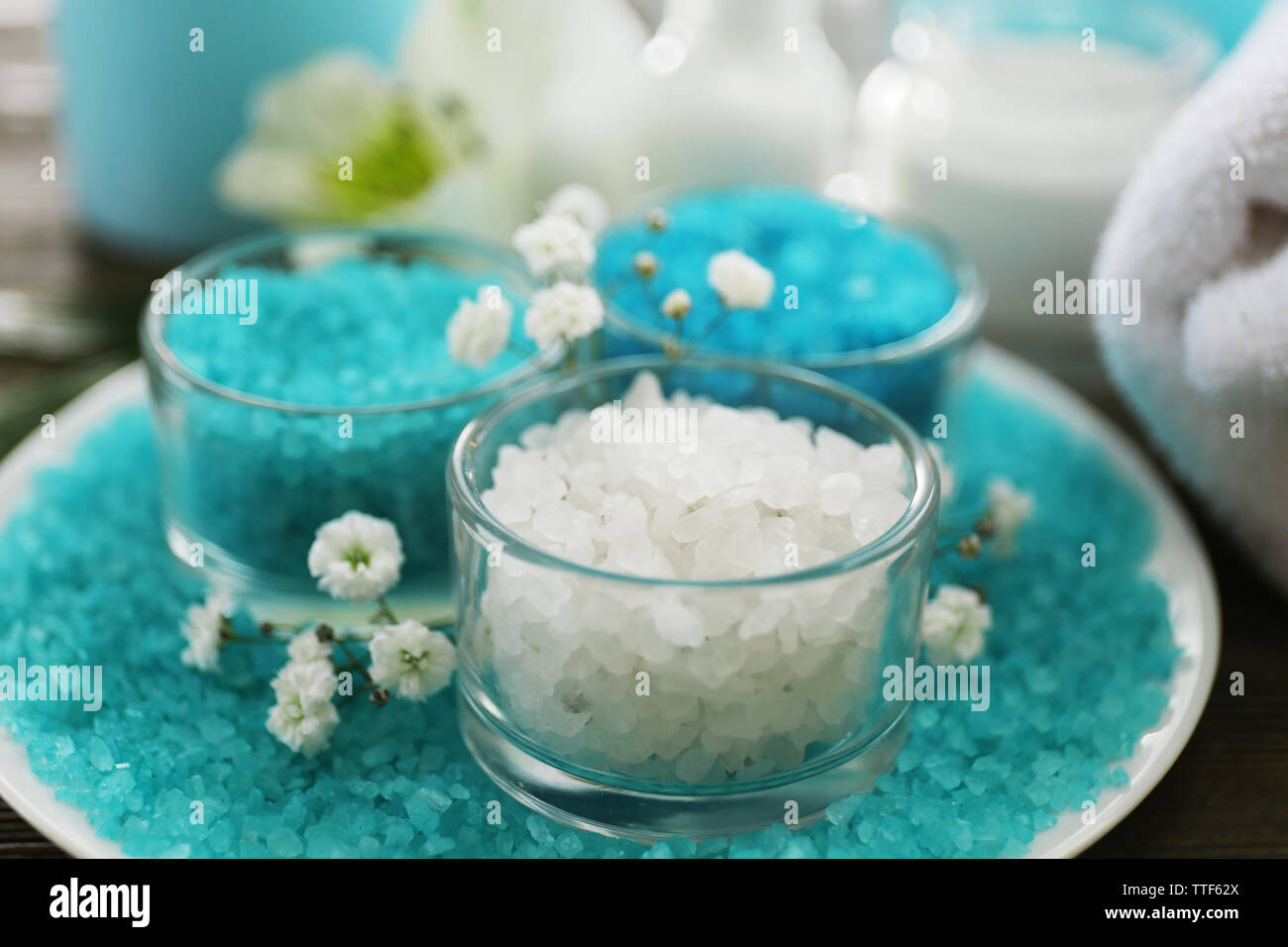 Glass saucers with light blue sea salt closeup Stock Photo - Alamy