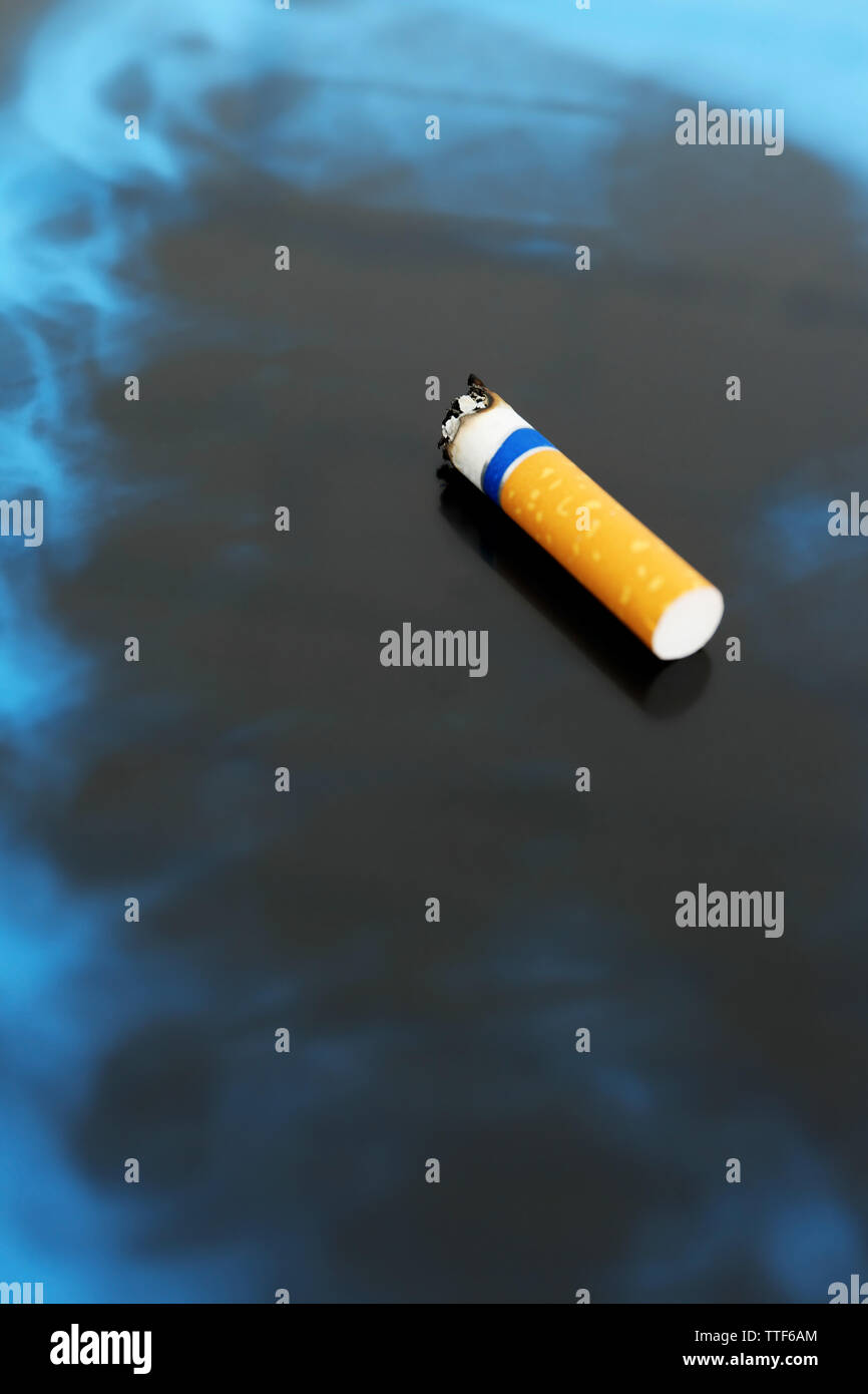 Cigarette on x-ray lung, close up Stock Photo - Alamy