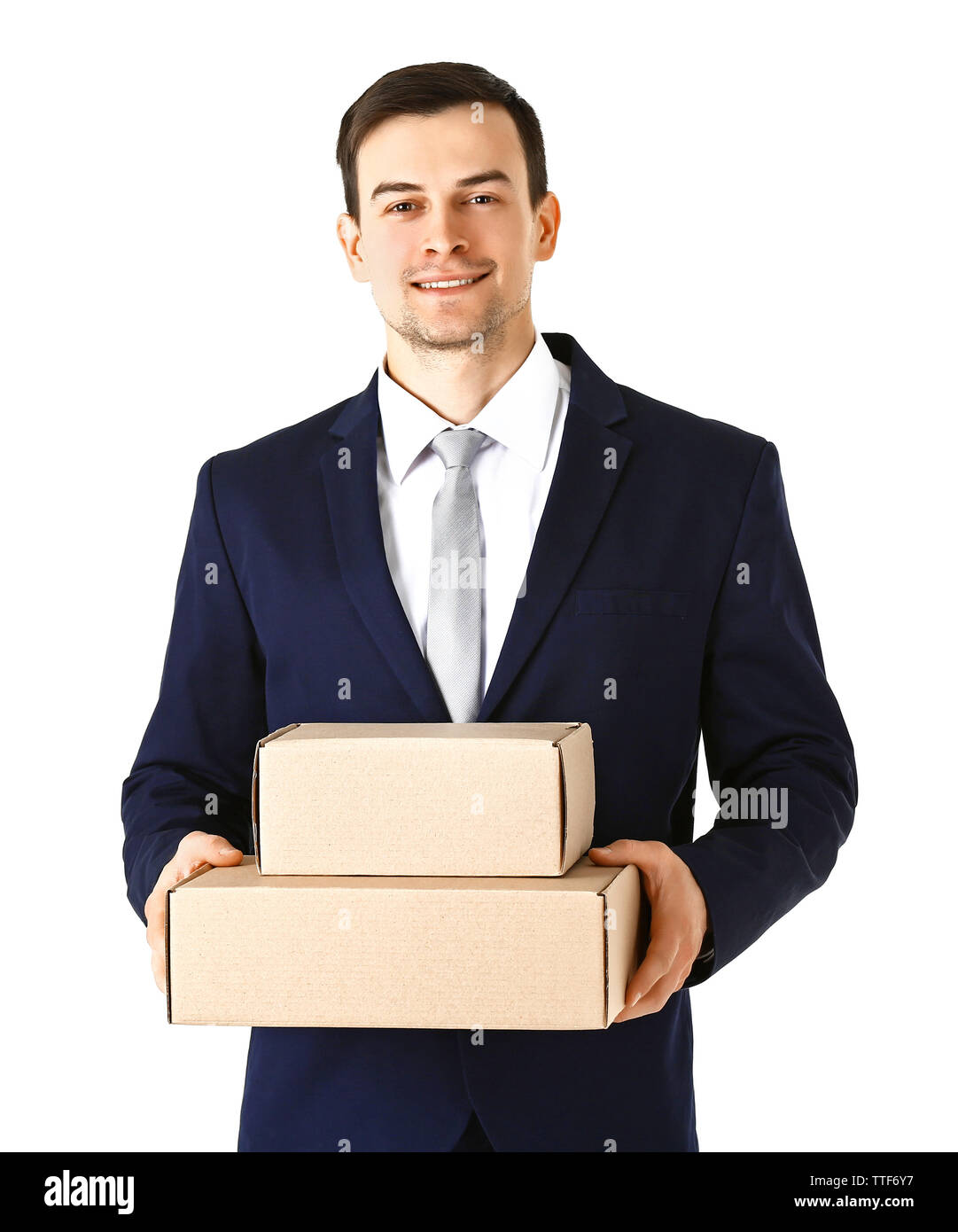 Man in suit holding carton boxes isolated on white background Stock ...