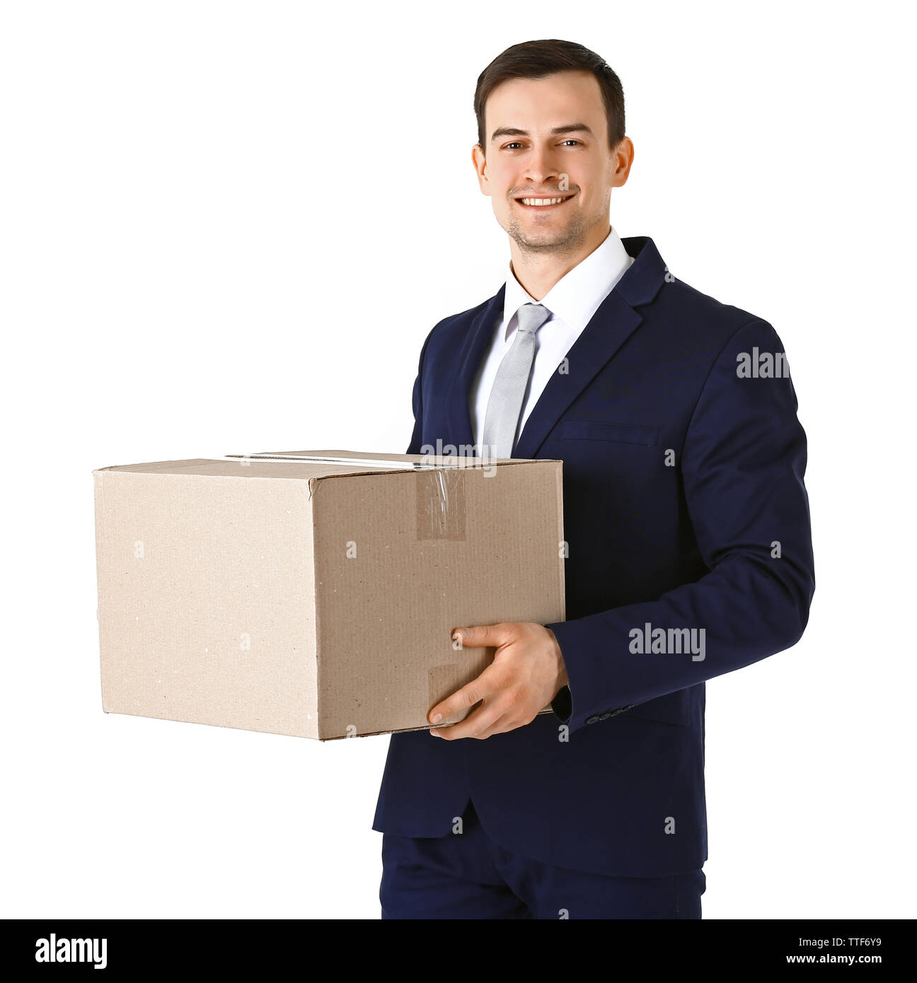 Man in suit holding carton boxes isolated on white background Stock ...
