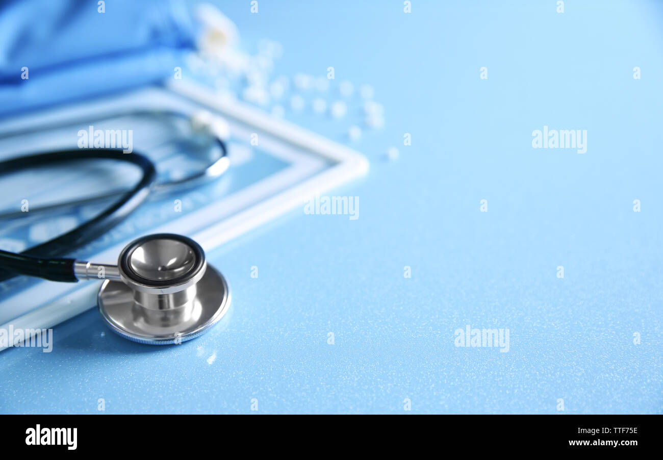 Stethoscope and medical equipment on a light blue background Stock ...