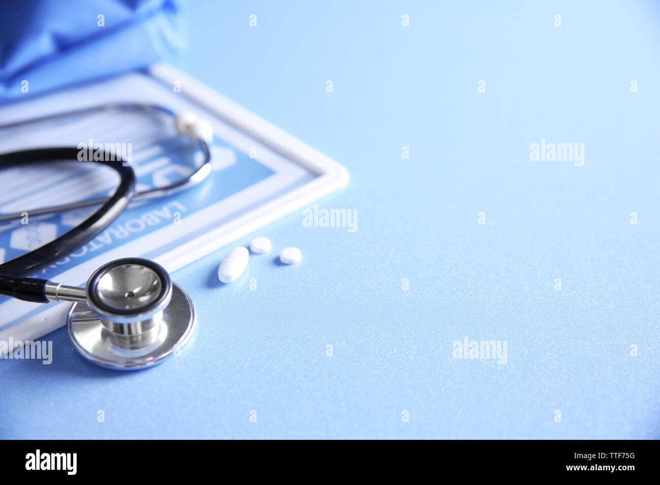Stethoscope and medical equipment on a light blue background Stock ...