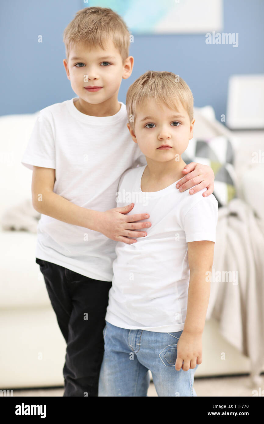 Portrait of cute cheerful brothers in the room Stock Photo - Alamy