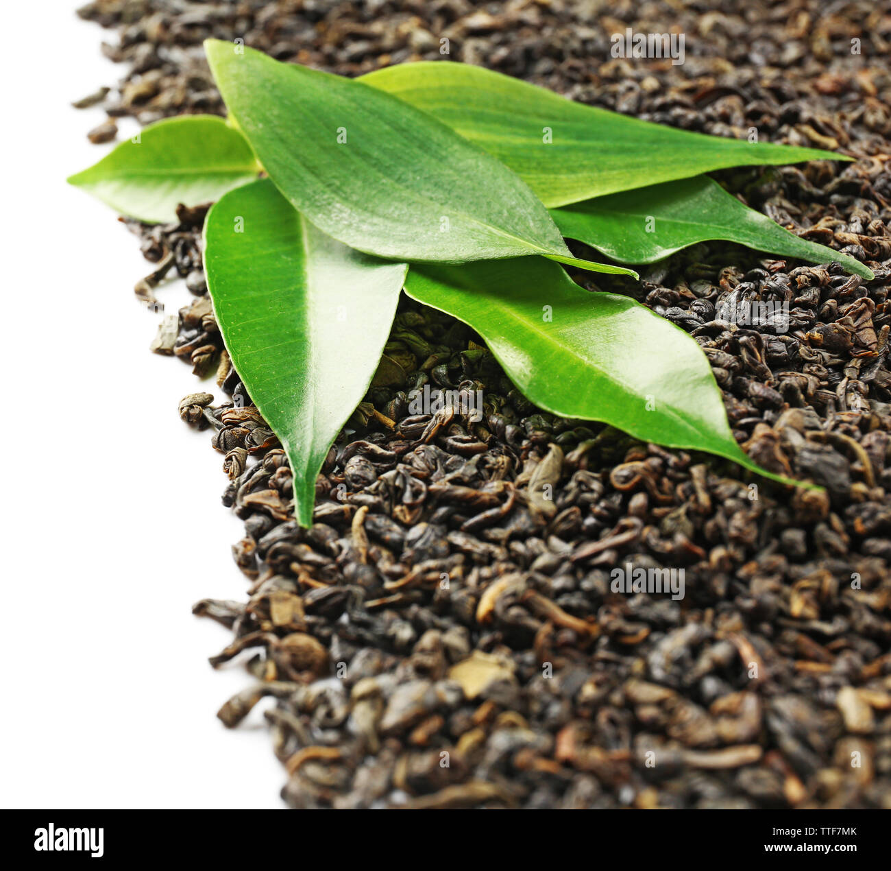 Pile of dry tea with green leaves, isolated on white Stock Photo - Alamy