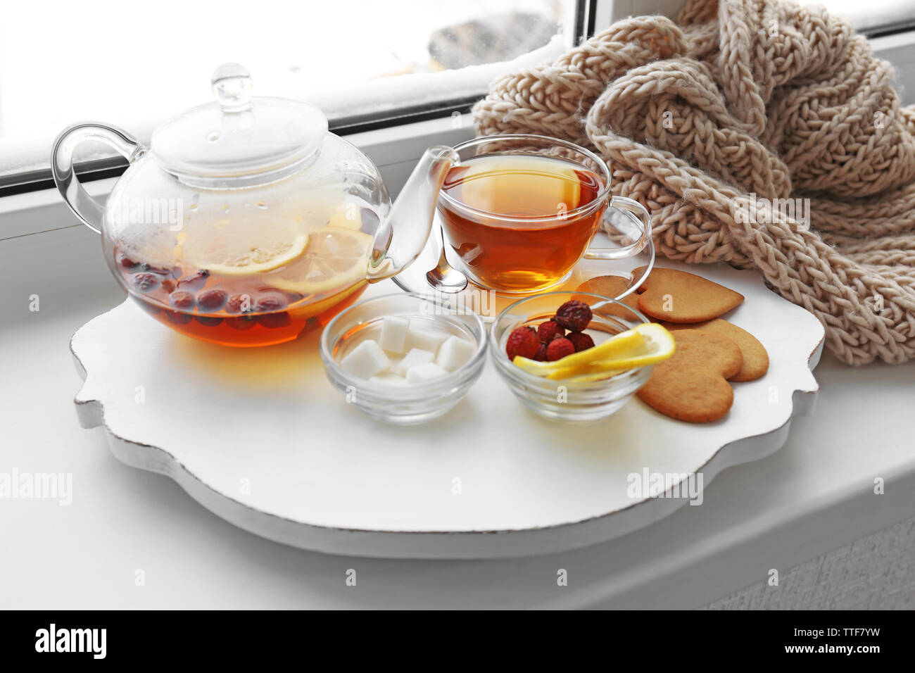 Tea set on a white wooden mat on the windowsill Stock Photo - Alamy