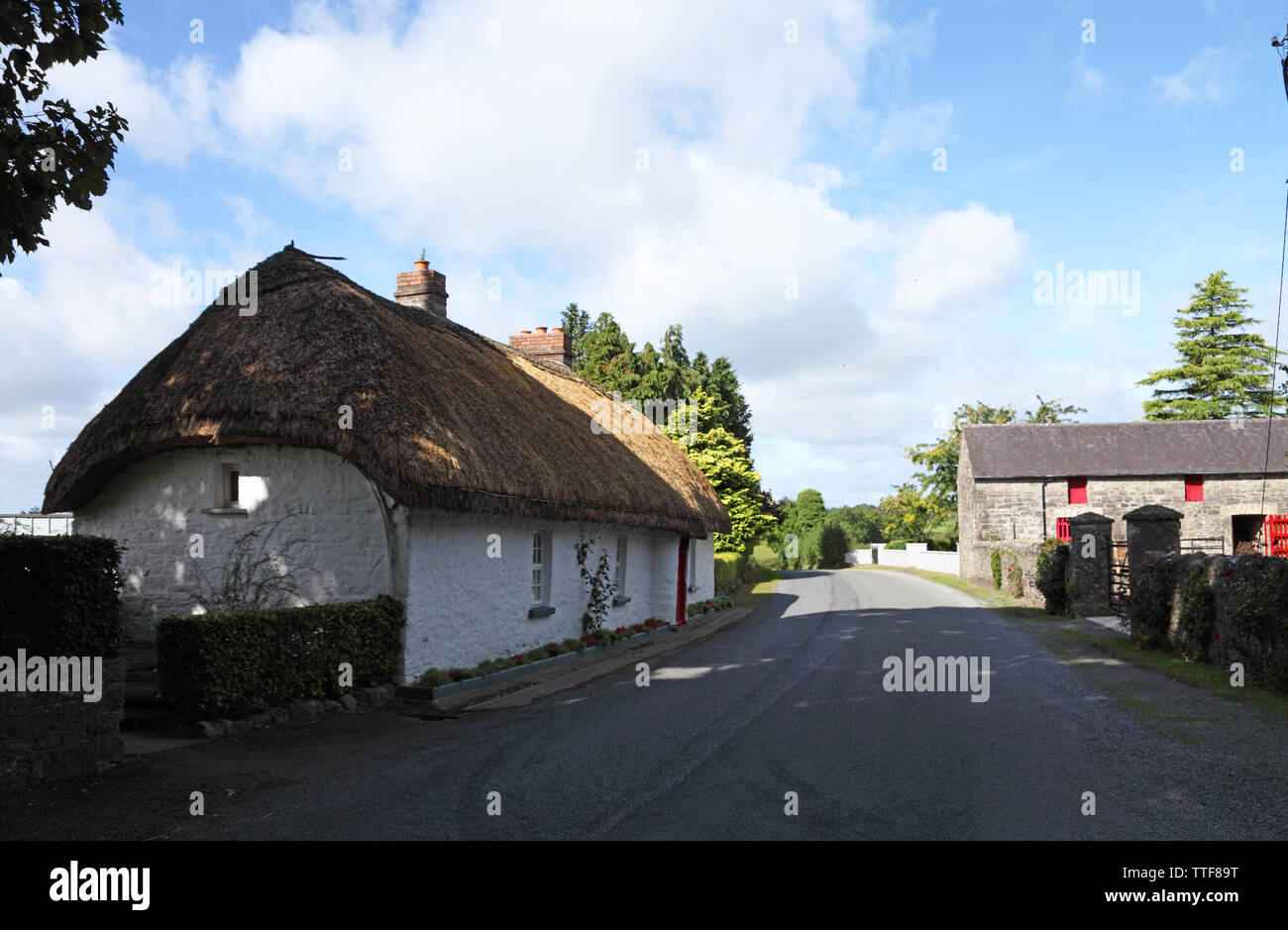Traditional thatched cottage farmhouse and peat farm on a lonely road ...