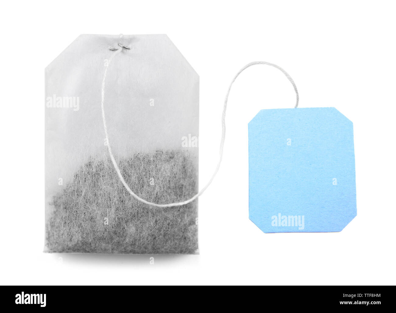 Teabag with blue label isolated on white background Stock Photo - Alamy