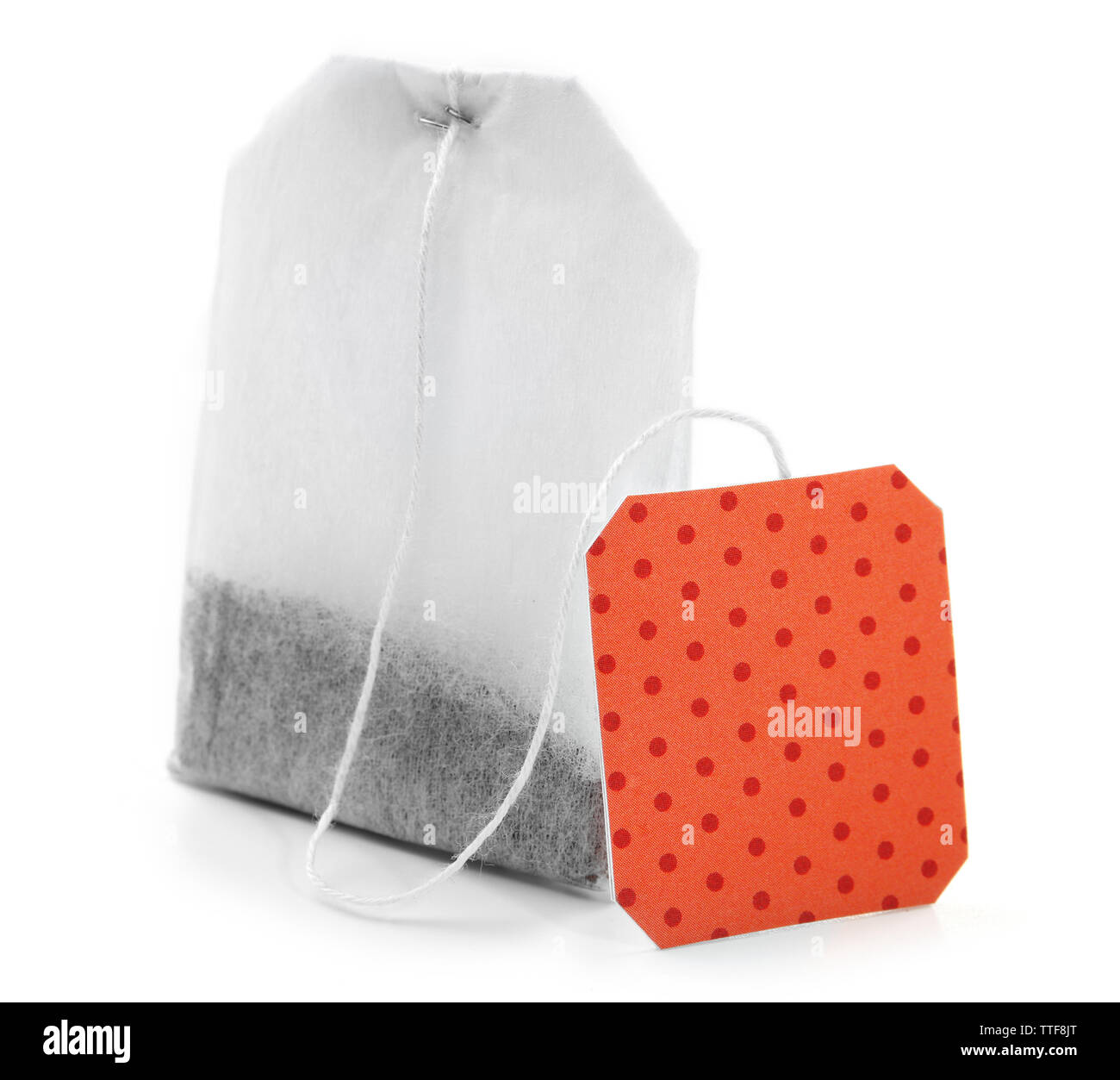 Teabag with red dotted label isolated on white background Stock Photo ...