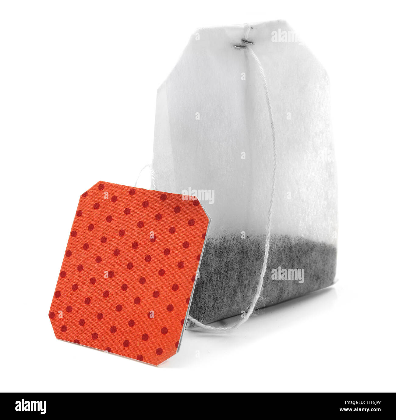 Teabag with red dotted label isolated on white background Stock Photo ...