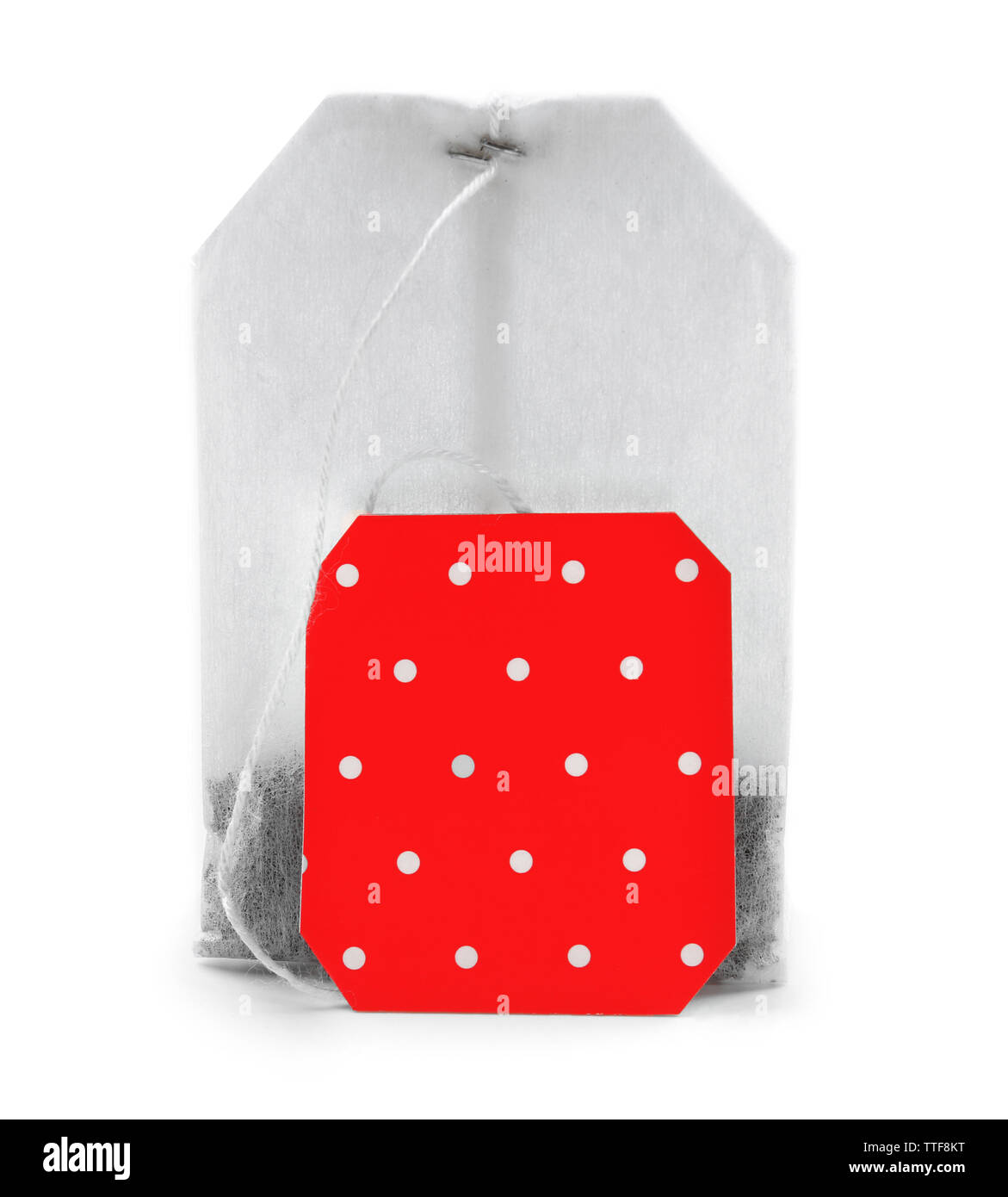 Teabag with red dotted label isolated on white background Stock Photo ...