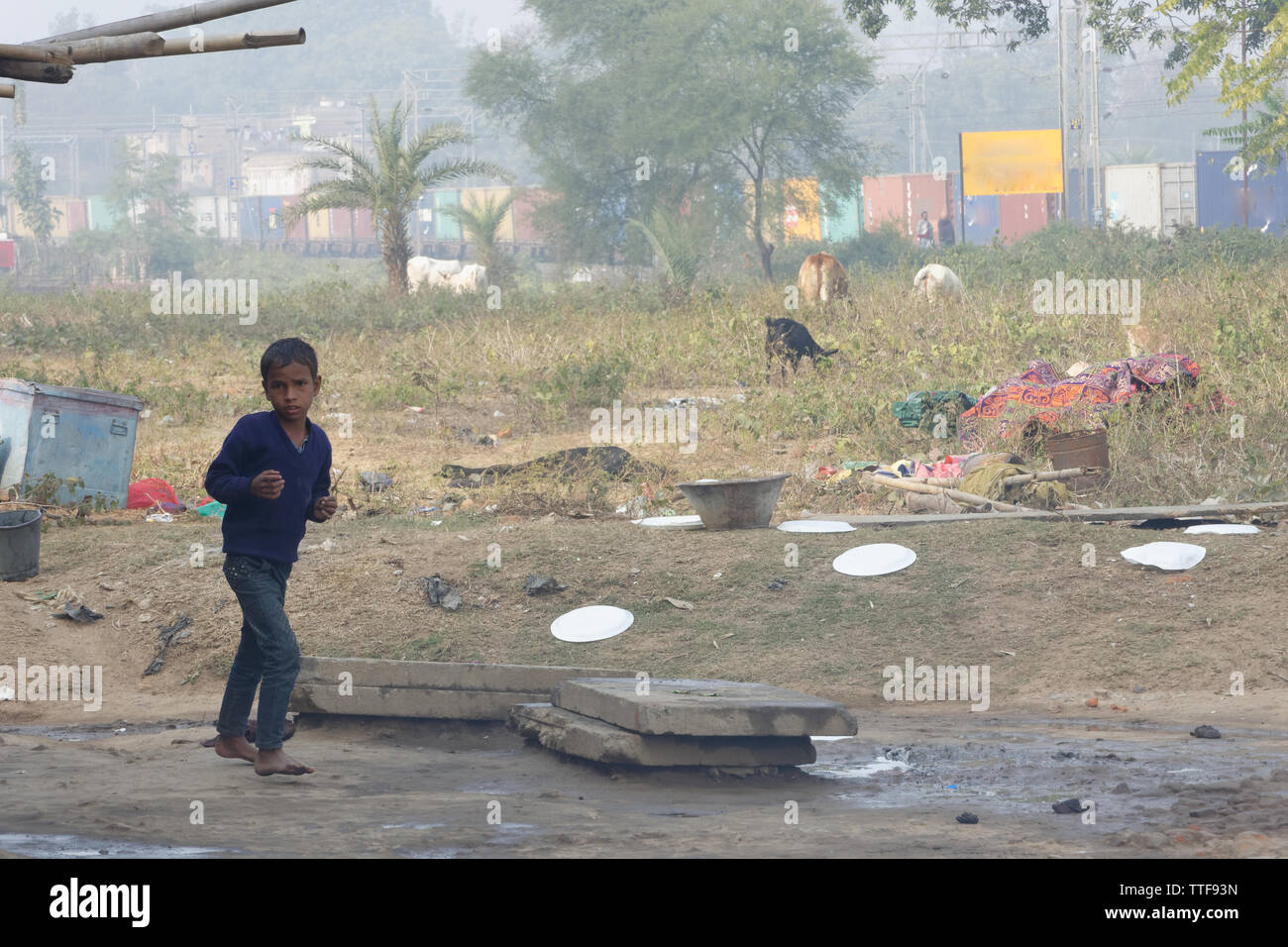 Indian street child is running on rural background Stock Photo - Alamy