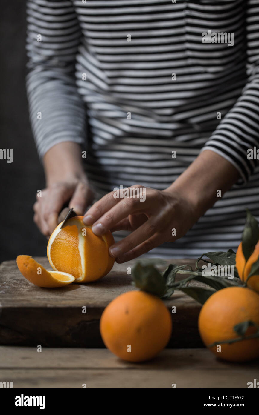 Cutting orange hi-res stock photography and images - Alamy