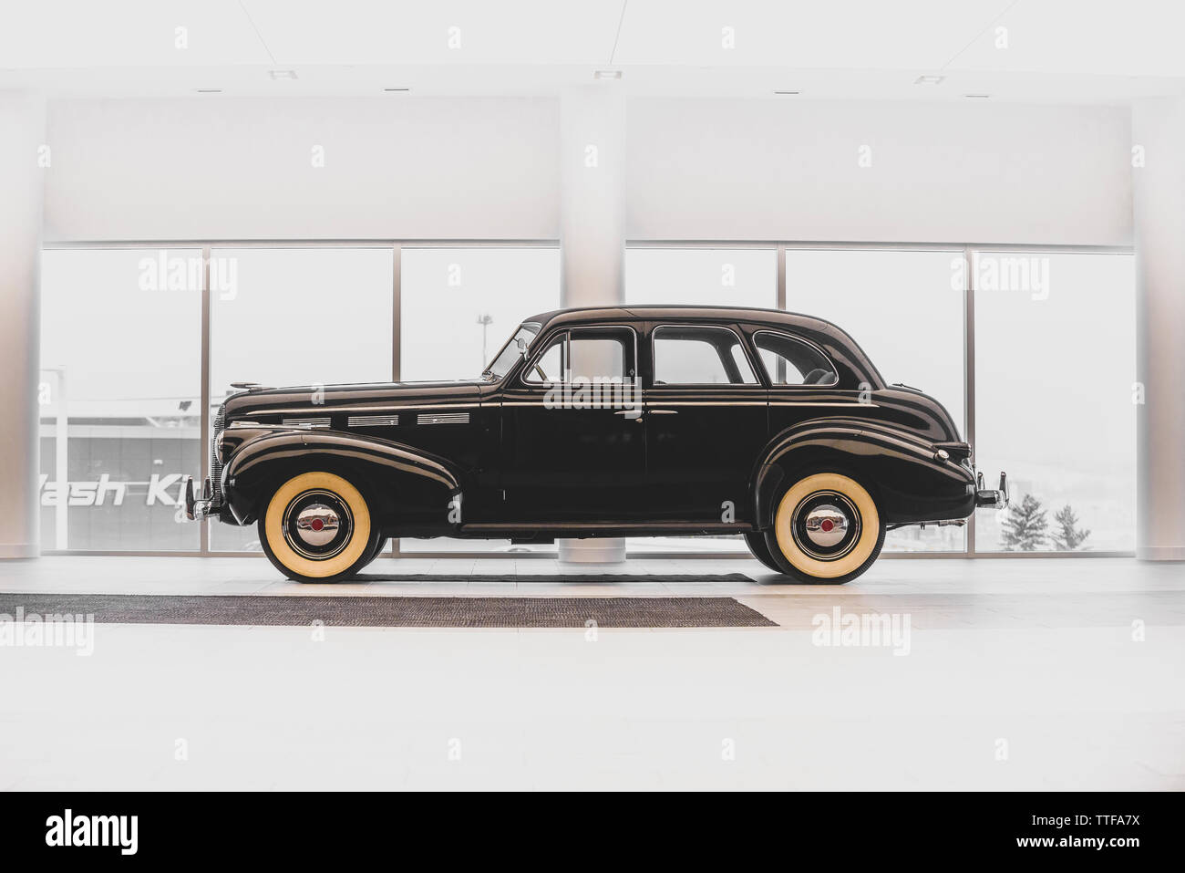 Side view of classic luxury car in dealership Stock Photo - Alamy