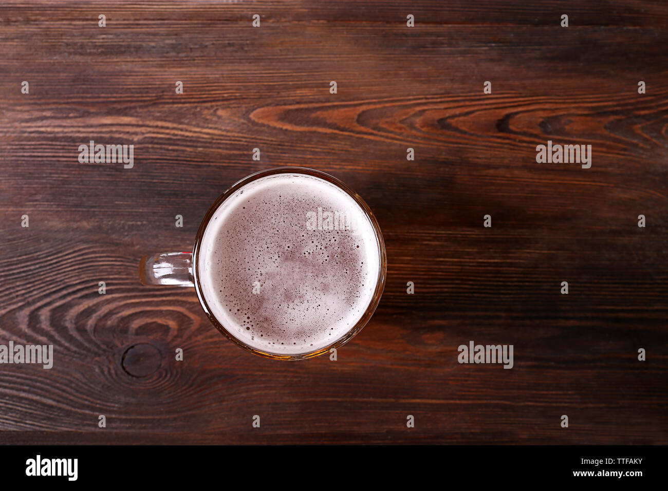 Glass of beer on wooden table, top view Stock Photo - Alamy