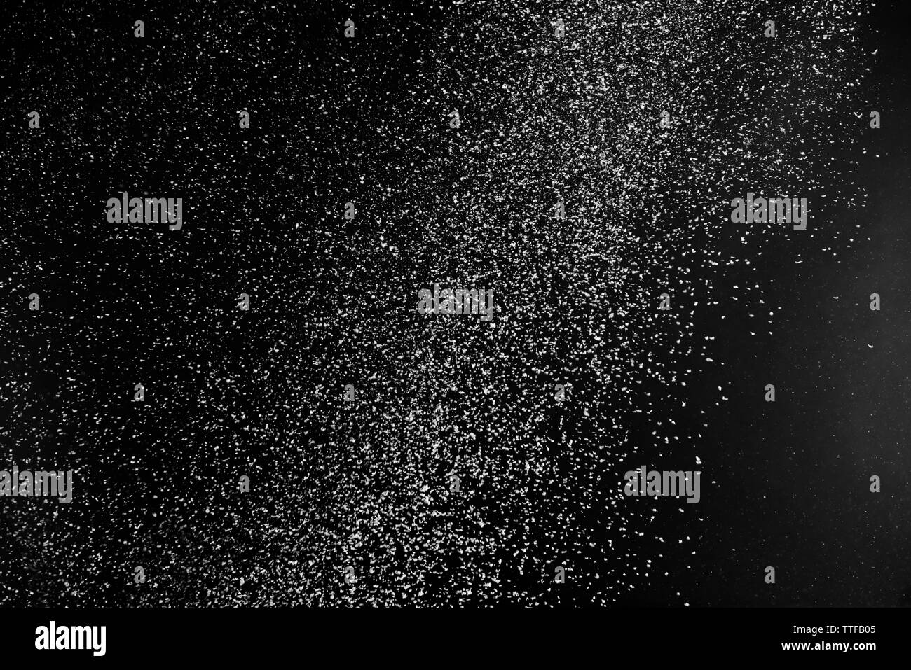 Snow flakes on dark background Stock Photo - Alamy
